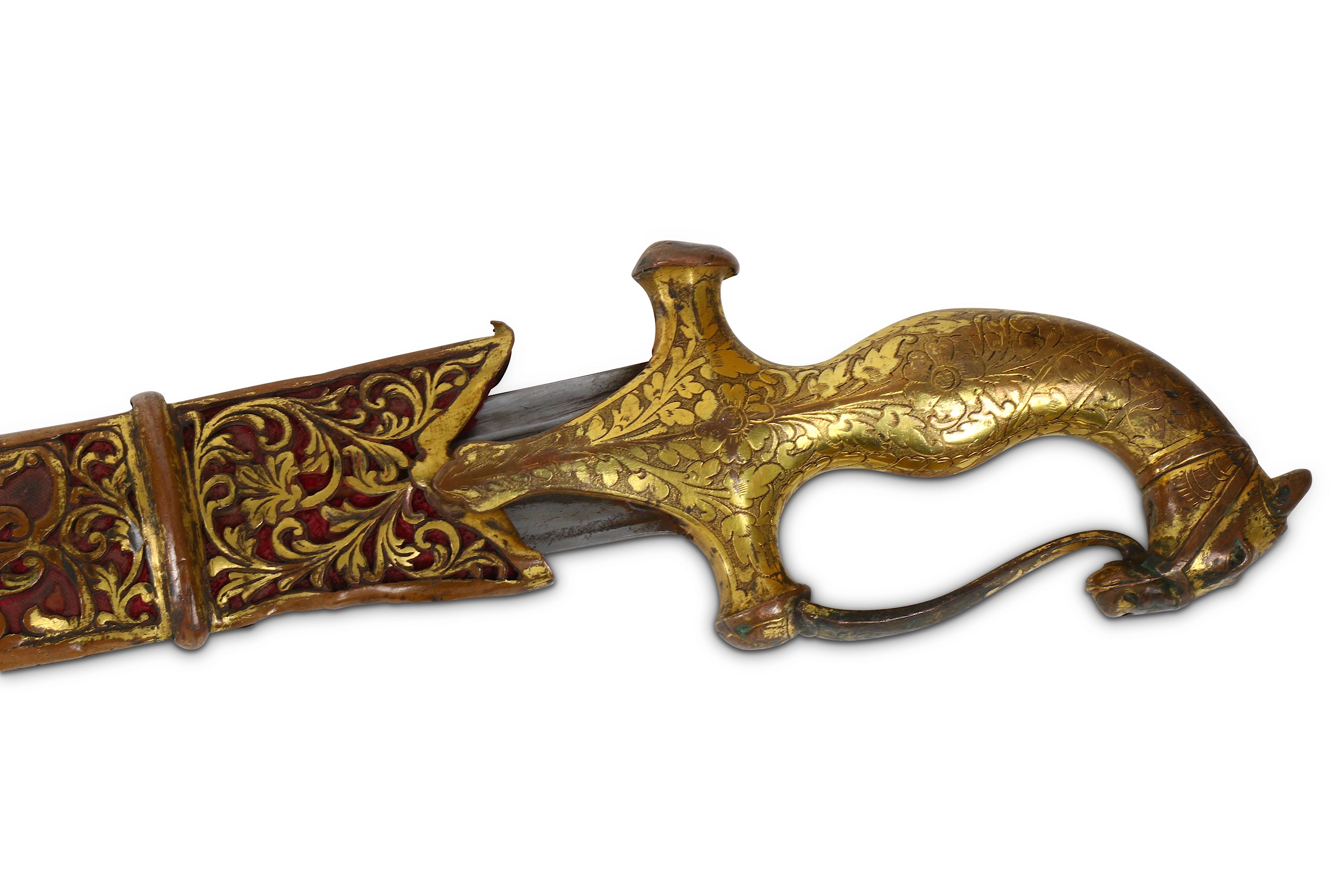 Lot 135 - AN INDIAN TALWAR SWORD WITH HORSE HEAD HILT