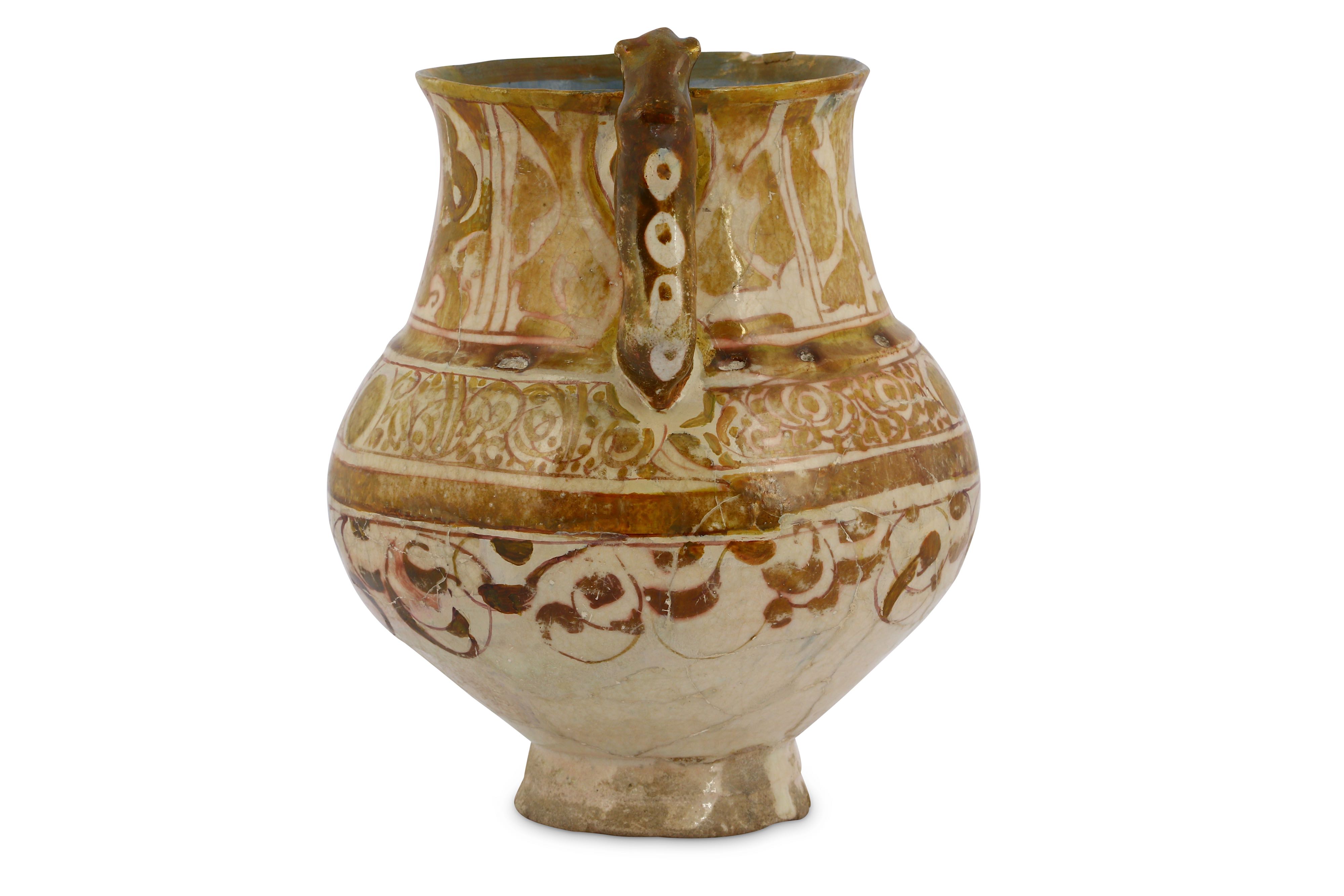 Lot 209 - A COPPER-LUSTRE POTTERY JUG Kashan, Iran,