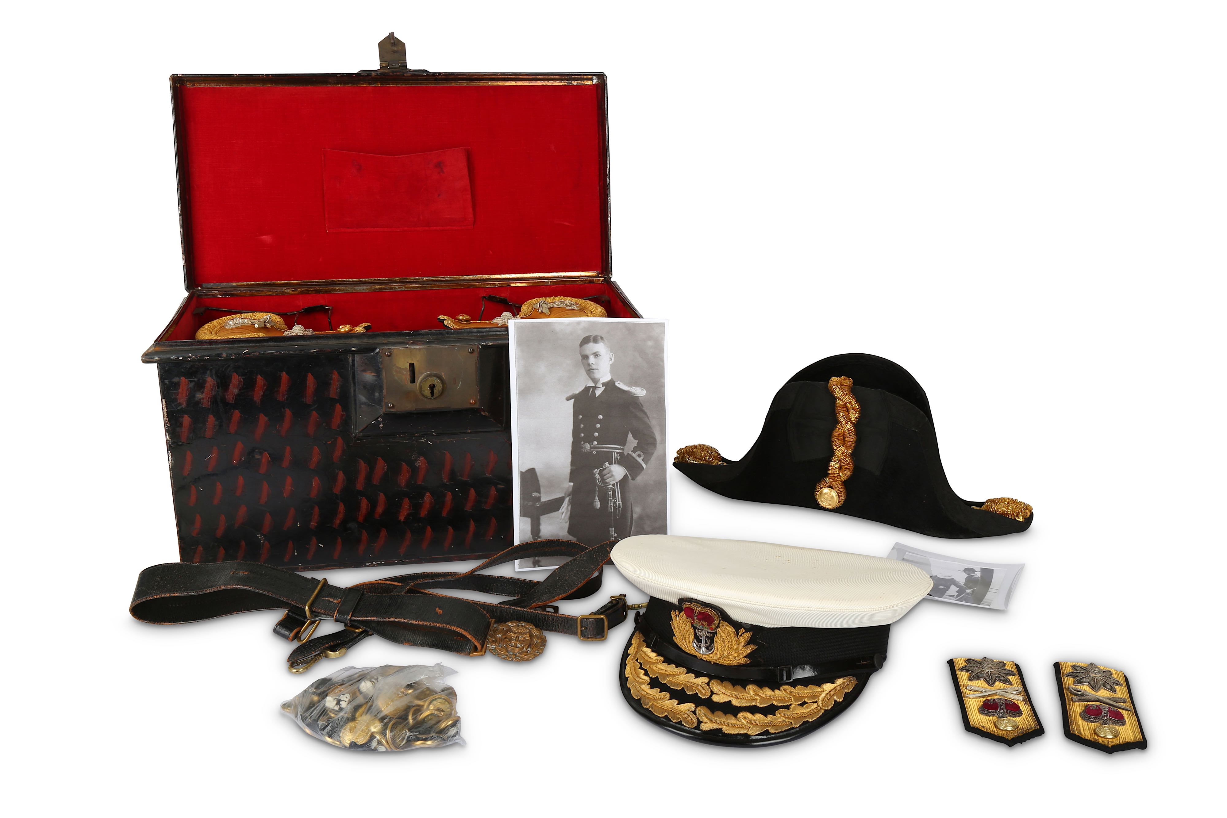 Lot 176 - A Royal Navy set of epaulettes, cap and tin,
