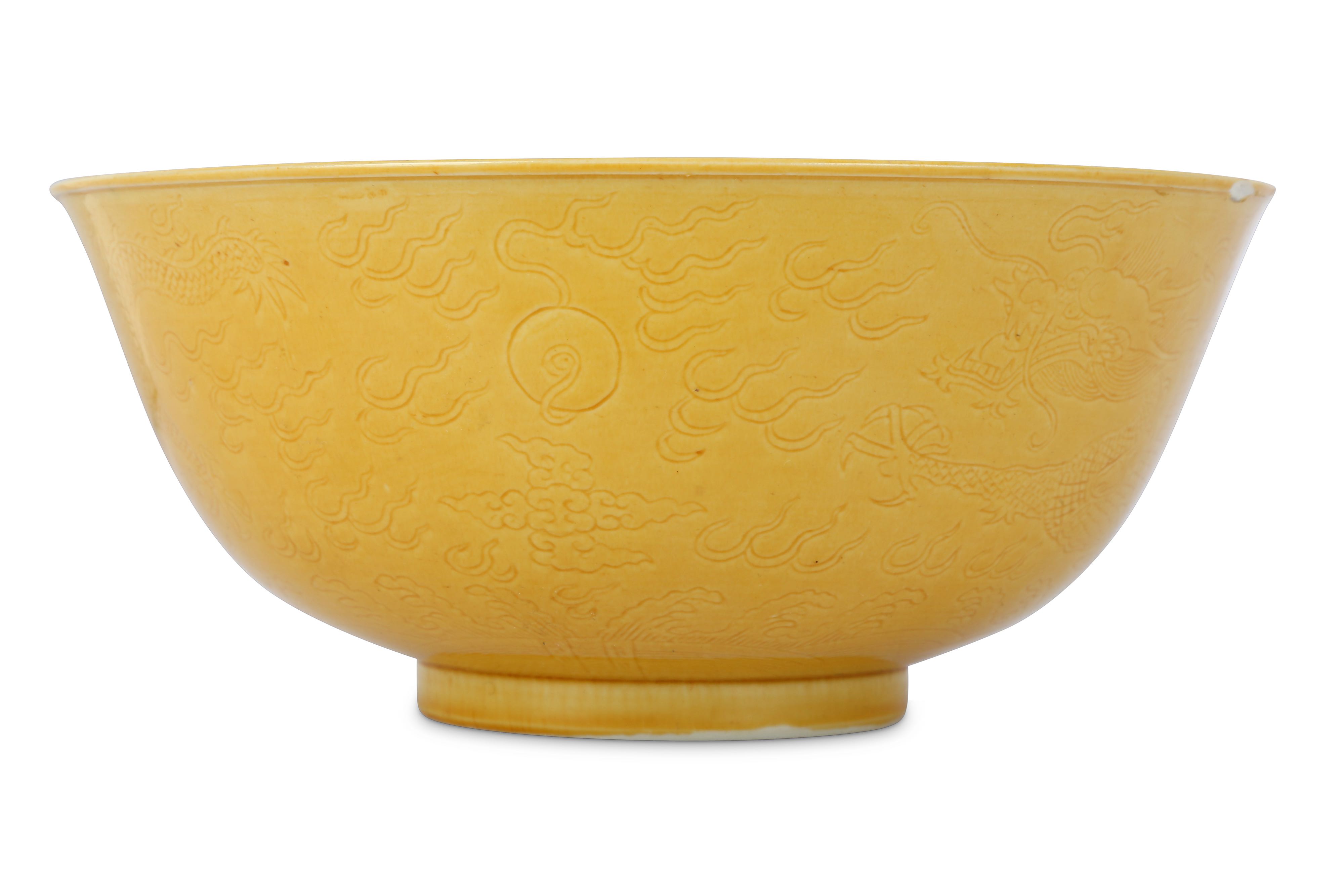 Lot 39 - A CHINESE MUSTARD-GLAZED ANHUA 'DRAGON' BOWL.