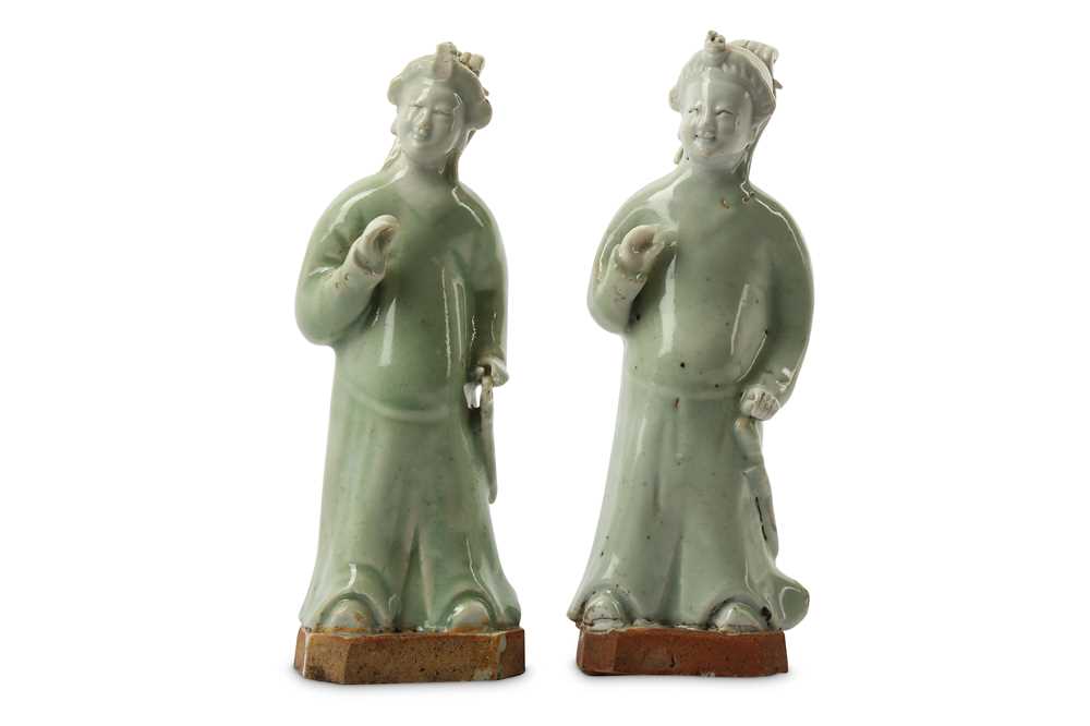 Lot 124 - TWO CHINESE CELADON-GLAZED FIGURES OF LADIES.