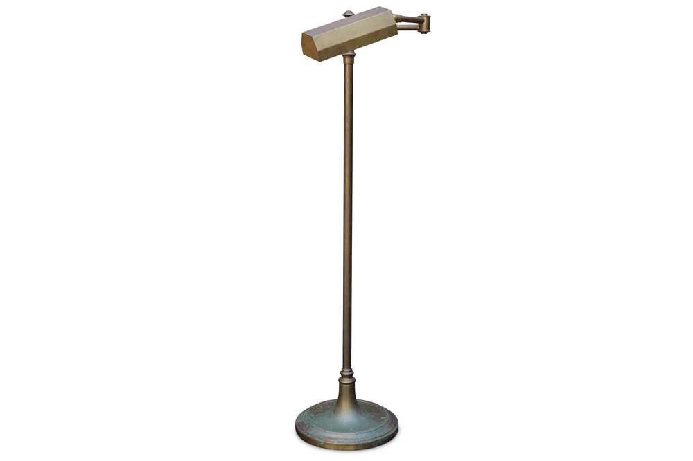 Lot 344 - A brass standard lamp with hinged arm above