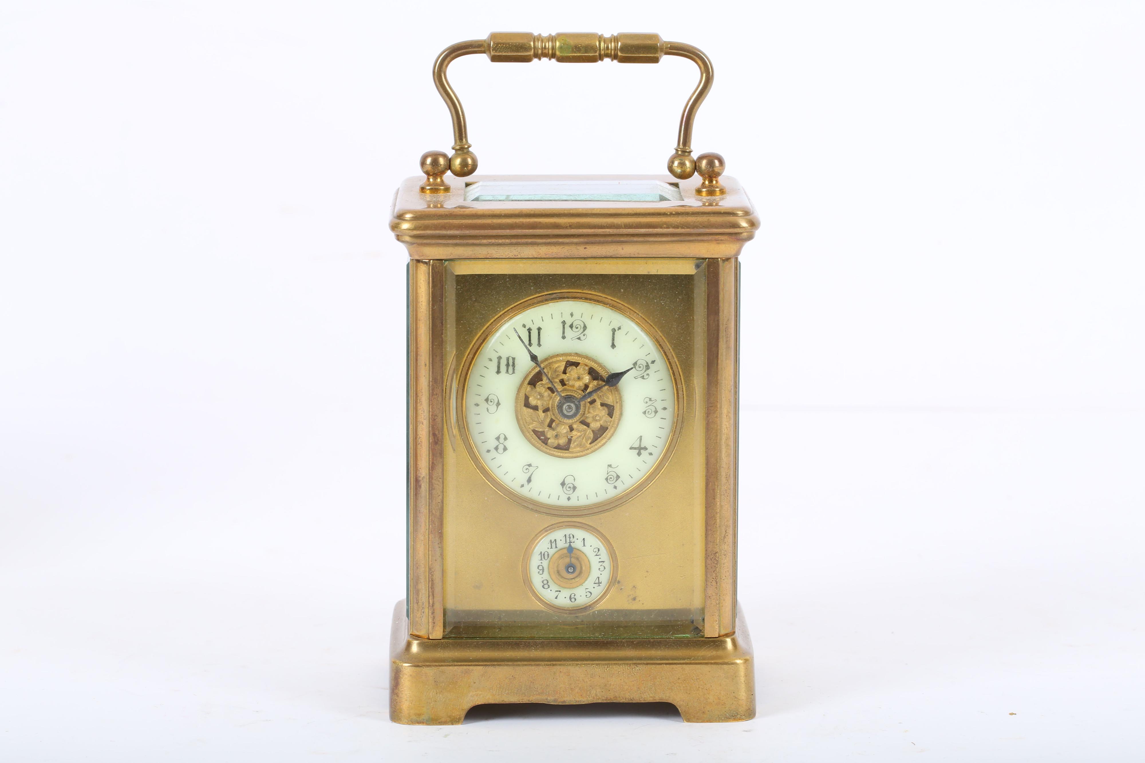 Lot 670 - An antique brass four glass brass alarm
