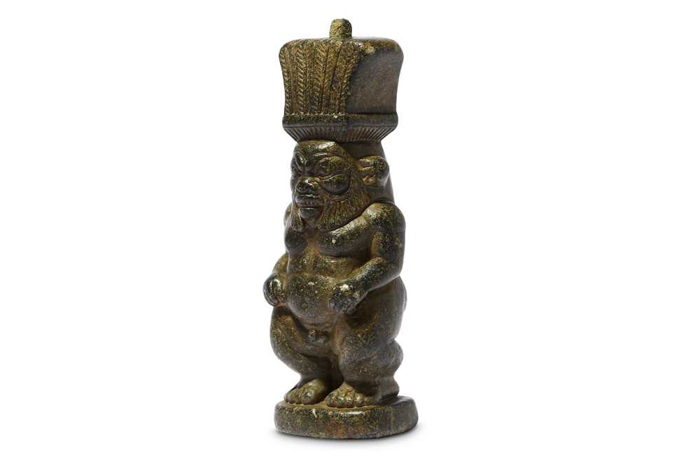Lot 65 - AN EGYPTIAN SERPENTINE FIGURE OF BES Late