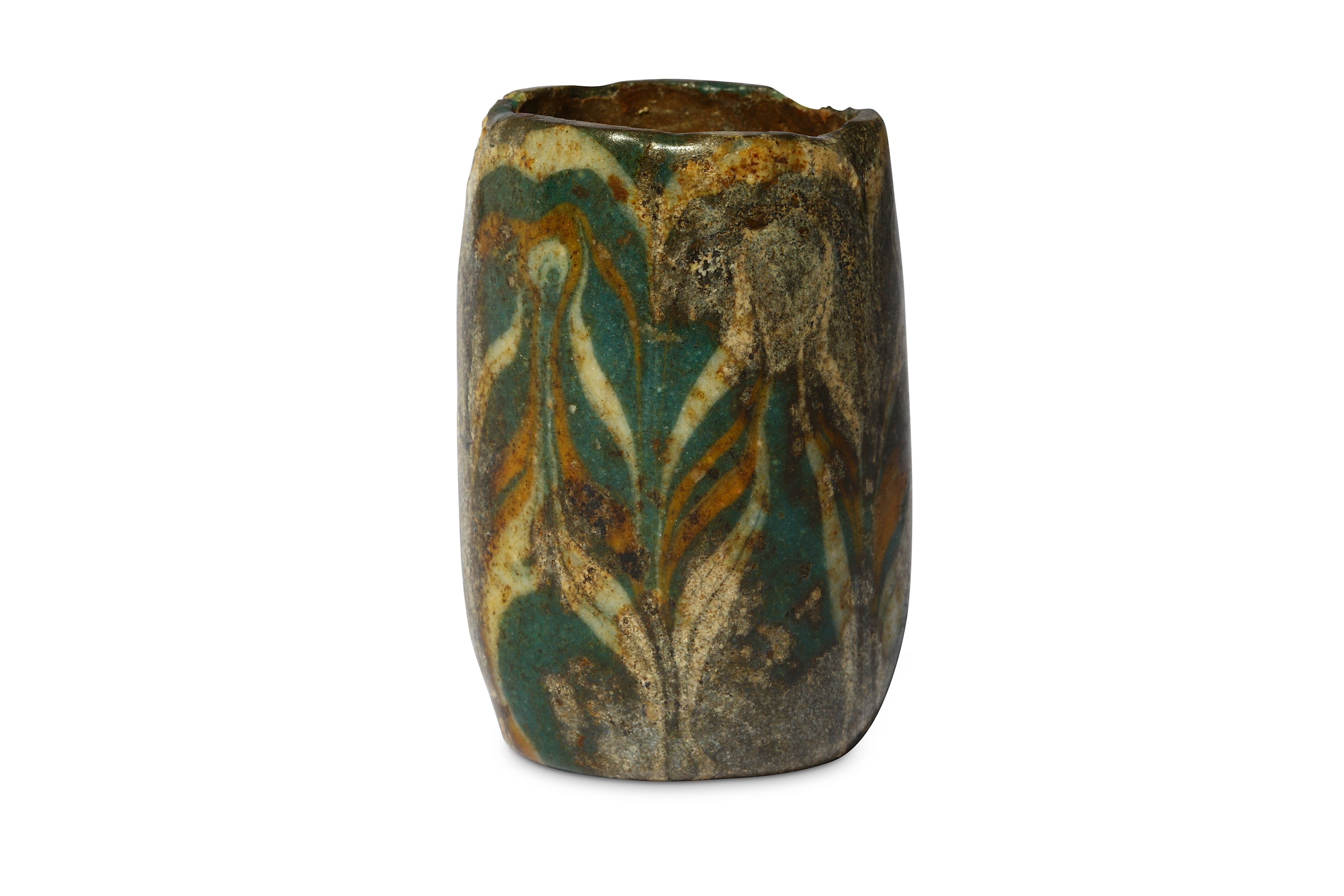Lot 168 - AN EGYPTIAN FRAGMENTARY CORE-FORMED GLASS
