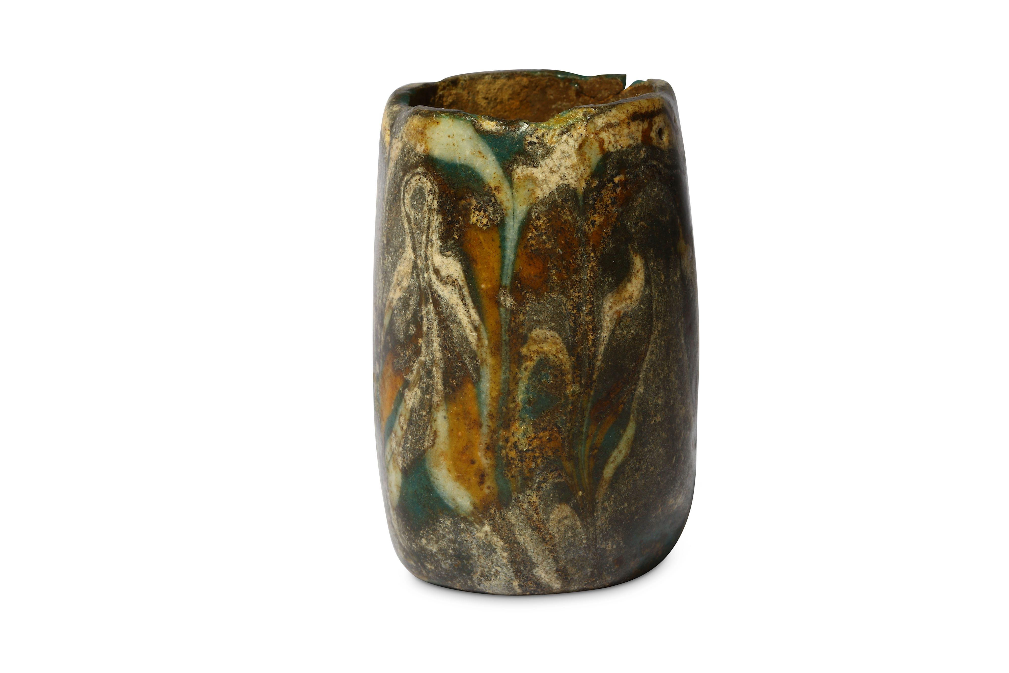 Lot 168 - AN EGYPTIAN FRAGMENTARY CORE-FORMED GLASS