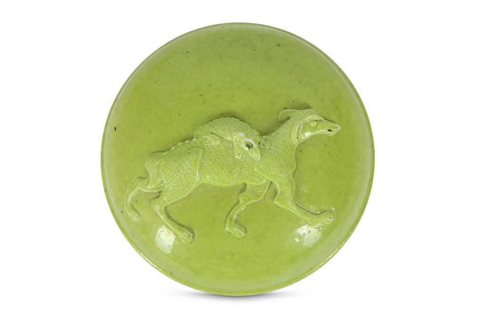 Lot 769 - A CHINESE LIME GREEN-GLAZED BISCUIT SEAL