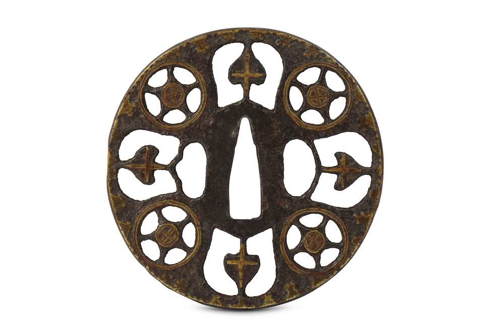 Lot 1012 - AN IRON MONSUKASHI NAMBAN TSUBA. Edo period.