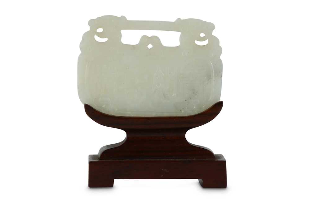 Lot 910 - A CHINESE WHITE JADE LOCK-SHAPED PANEL. Qing