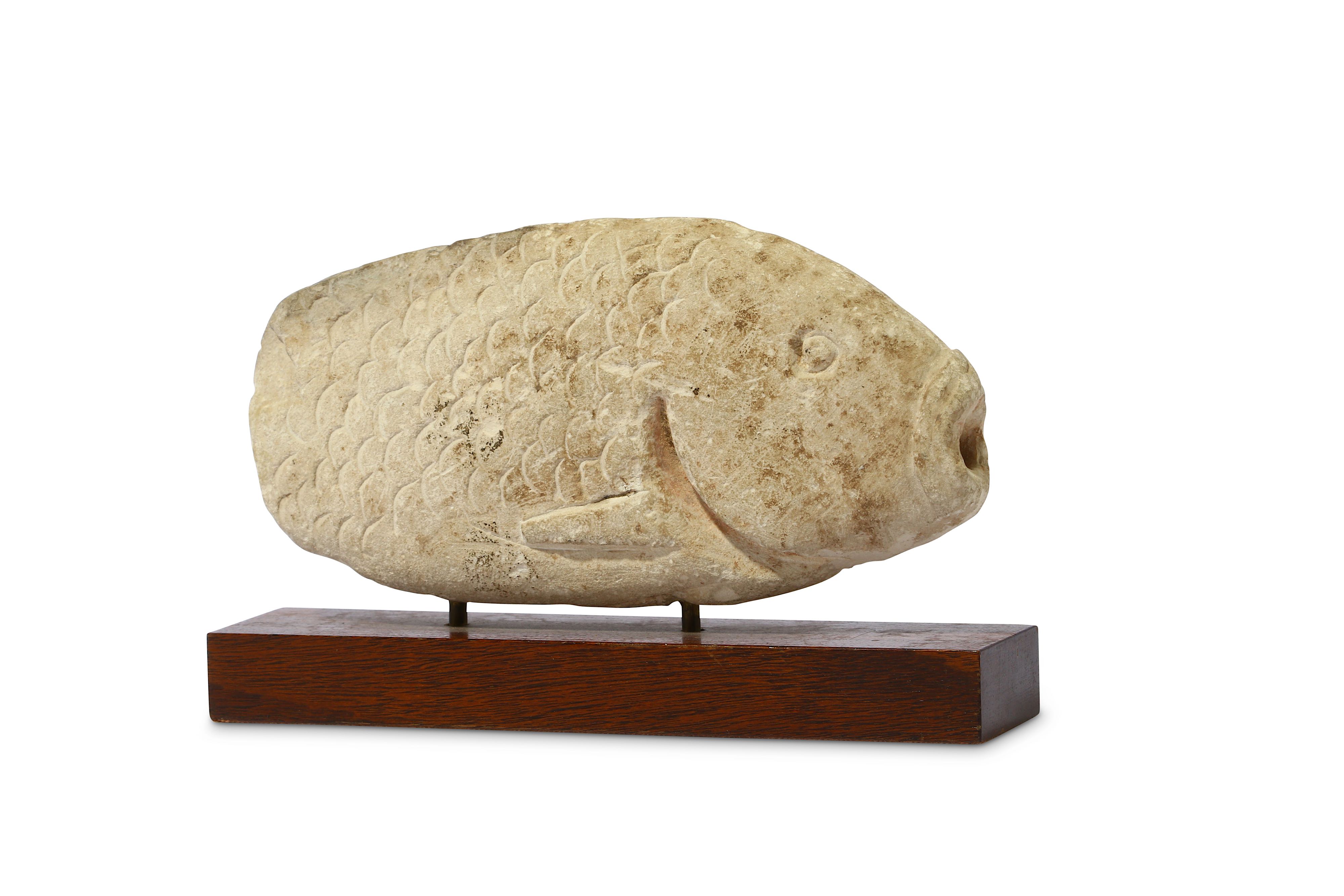 Lot 71 - AN EGYPTIAN LIMESTONE FISH Ptolemaic - Roman