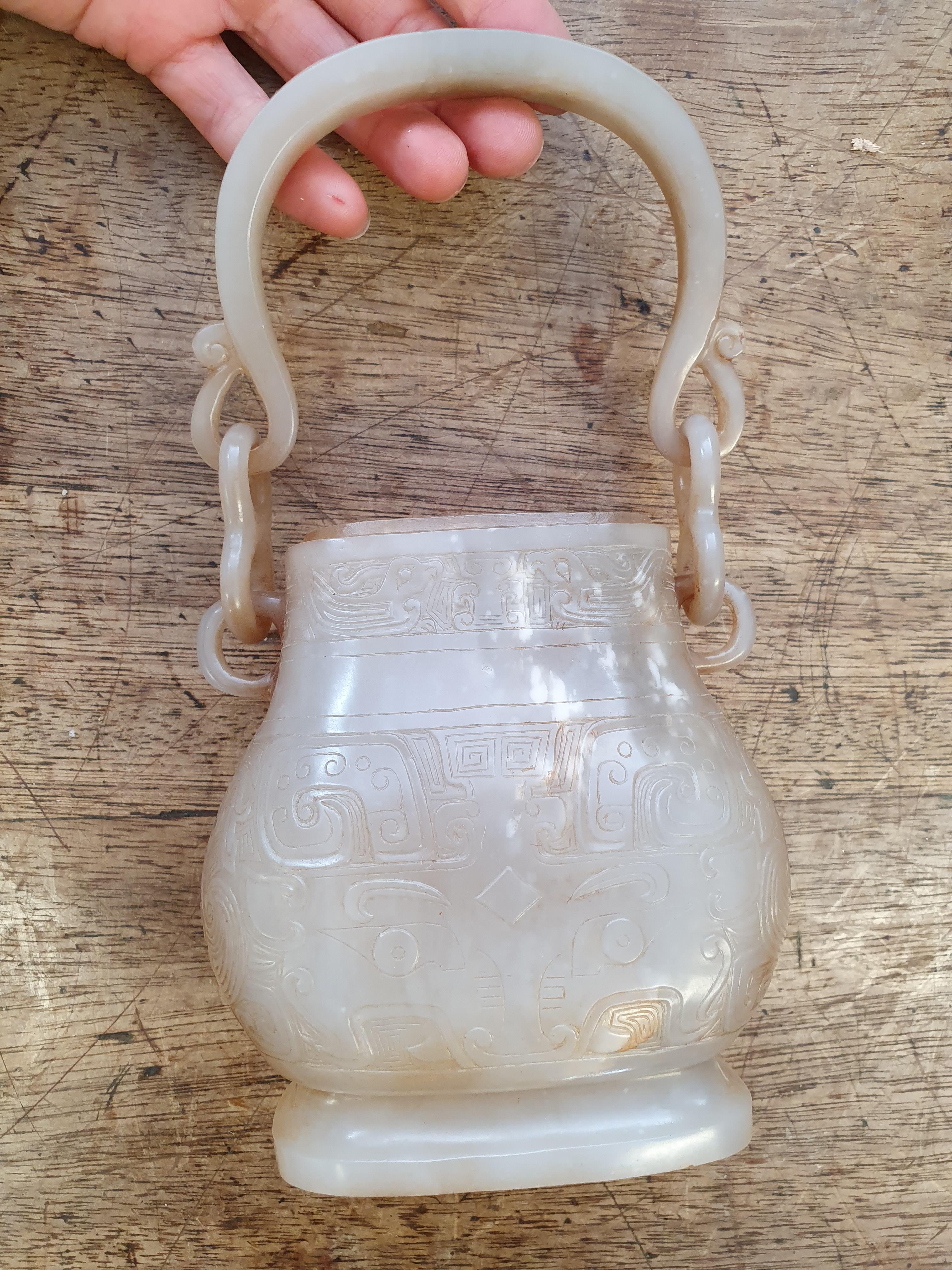 Lot 254 - A CHINESE CREAM JADE VESSEL AND COVER.