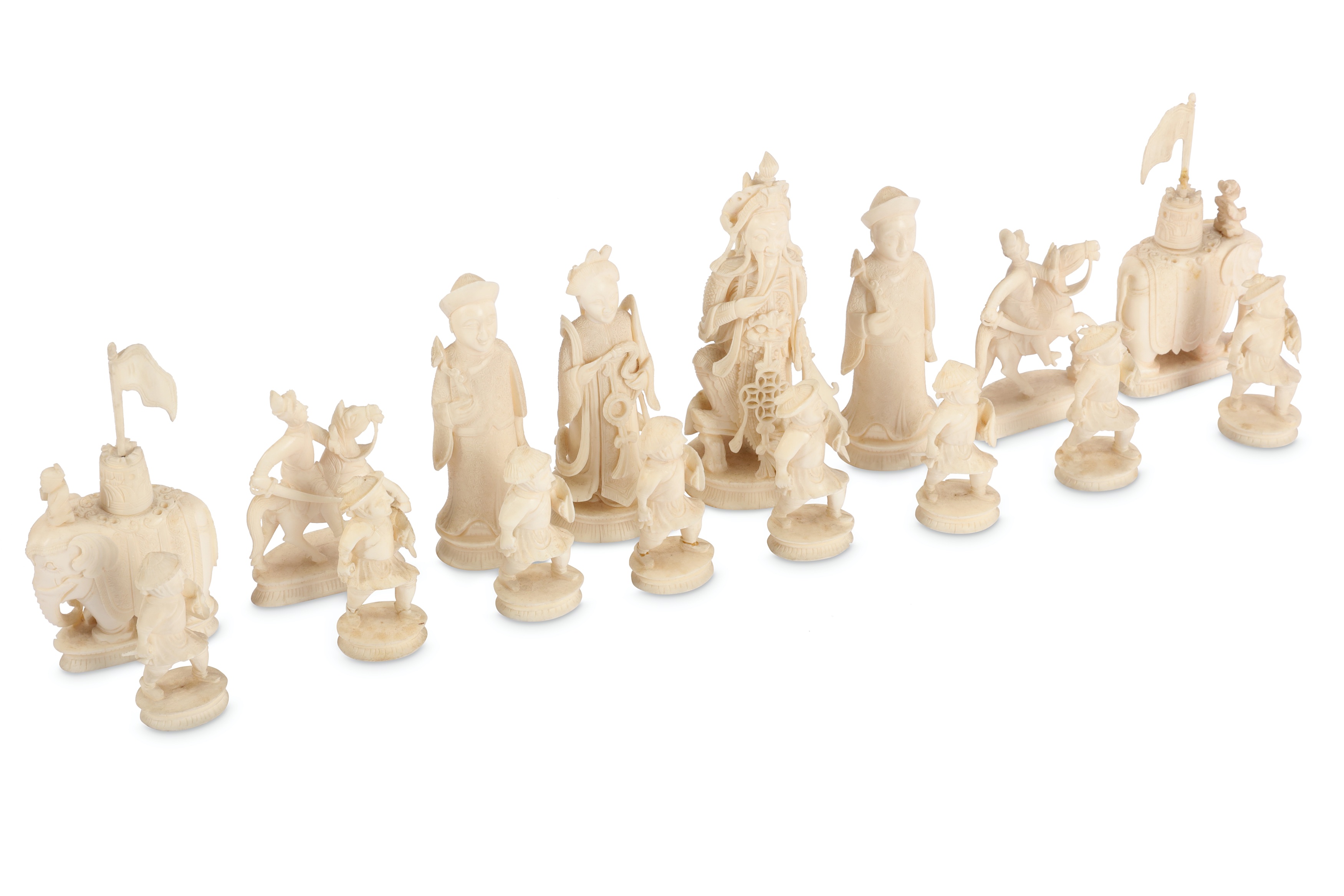 Lot 257 - A late 19th century carved ivory chess set,