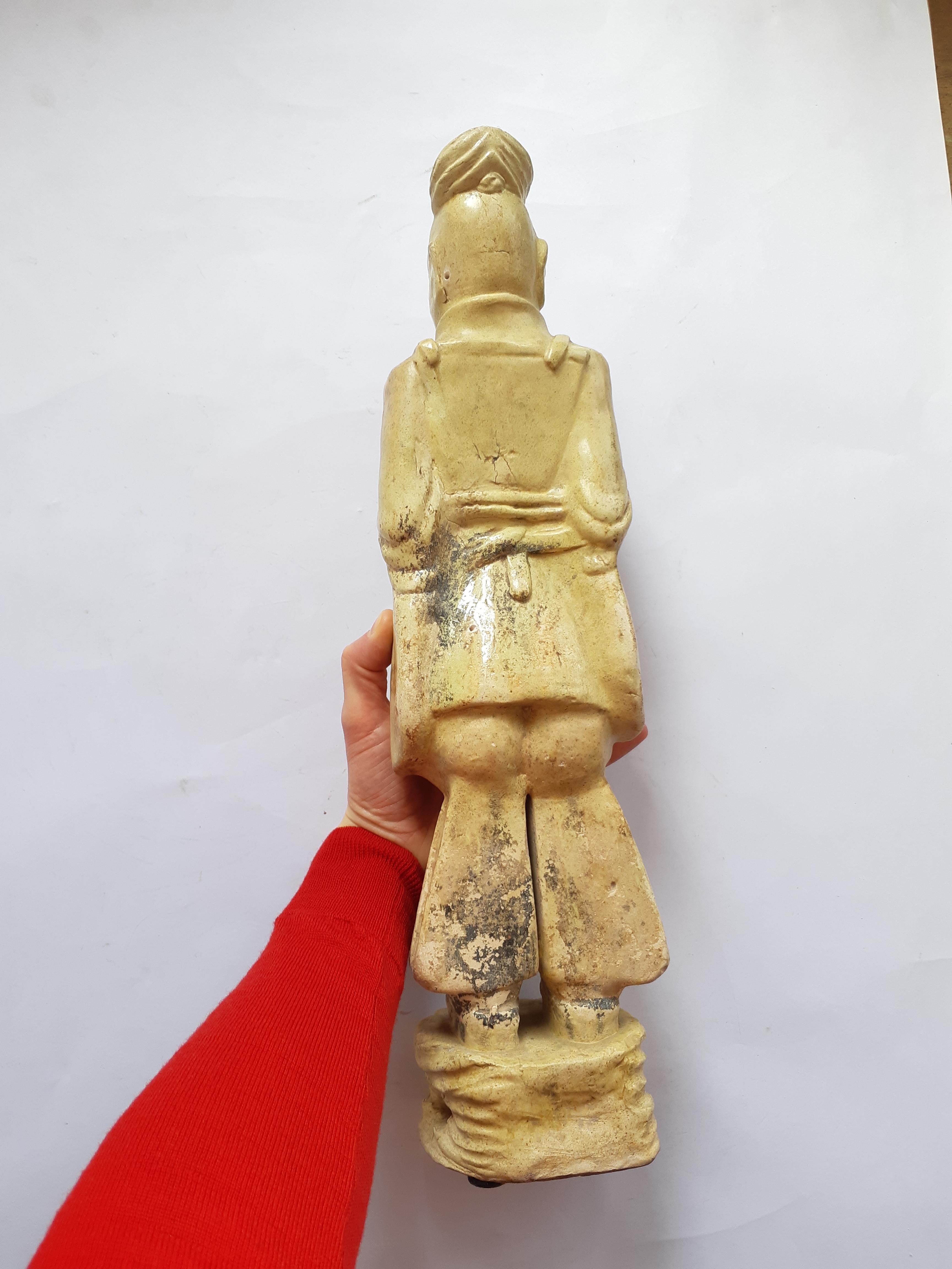 Lot 233 - A RARE CHINESE STRAW GLAZED FIGURE OF AN