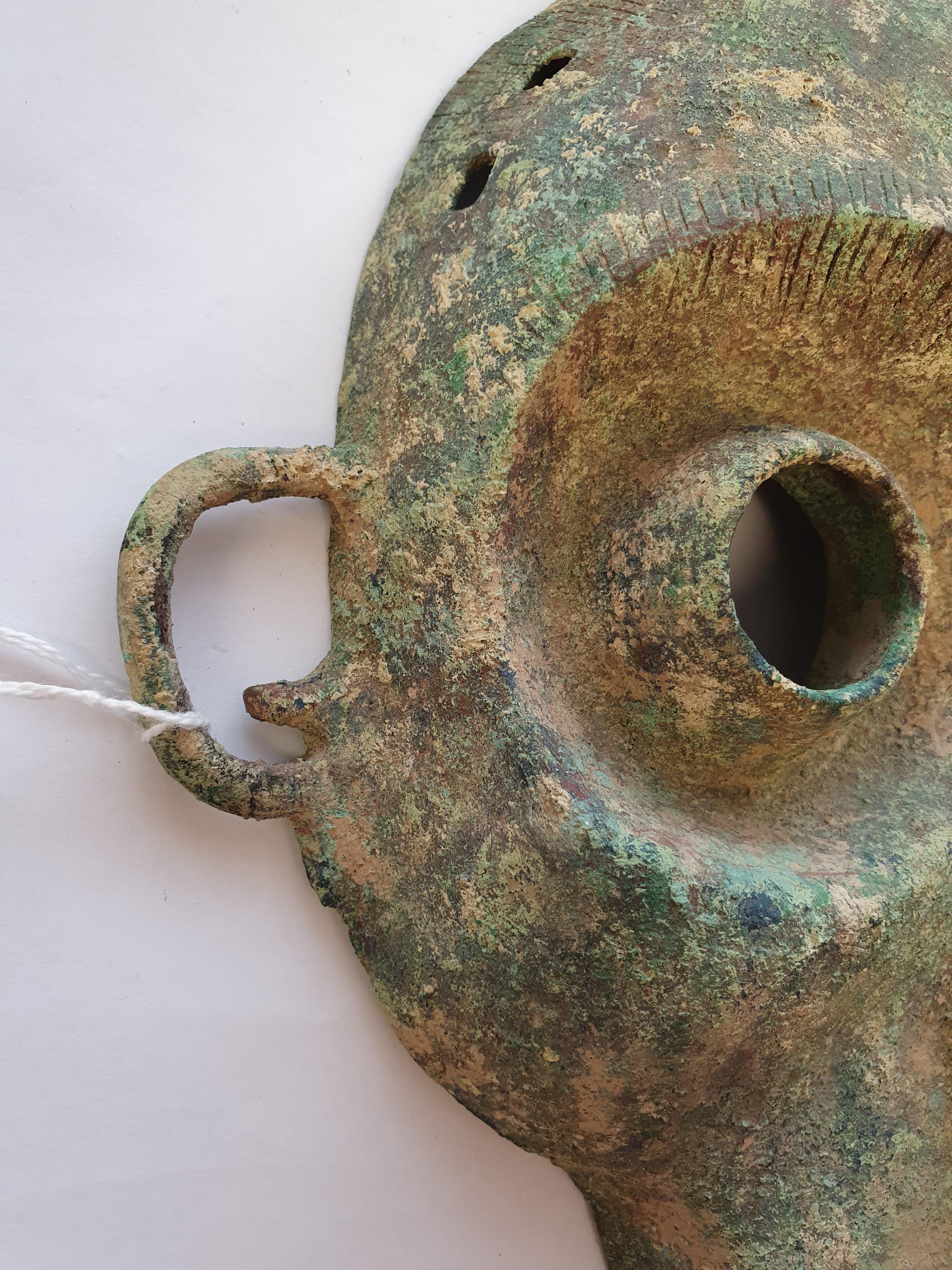 Lot 339 - A CHINESE BRONZE MASK.