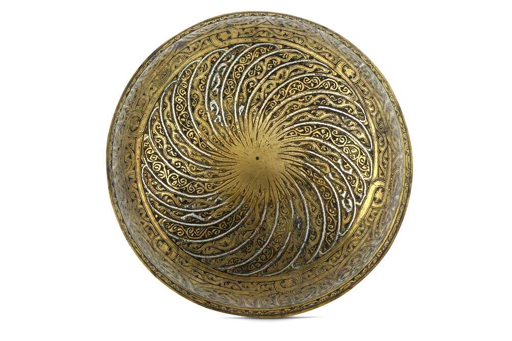Lot 82 - A VENETO-SARACENIC SILVER-INLAID BRASS BOWL