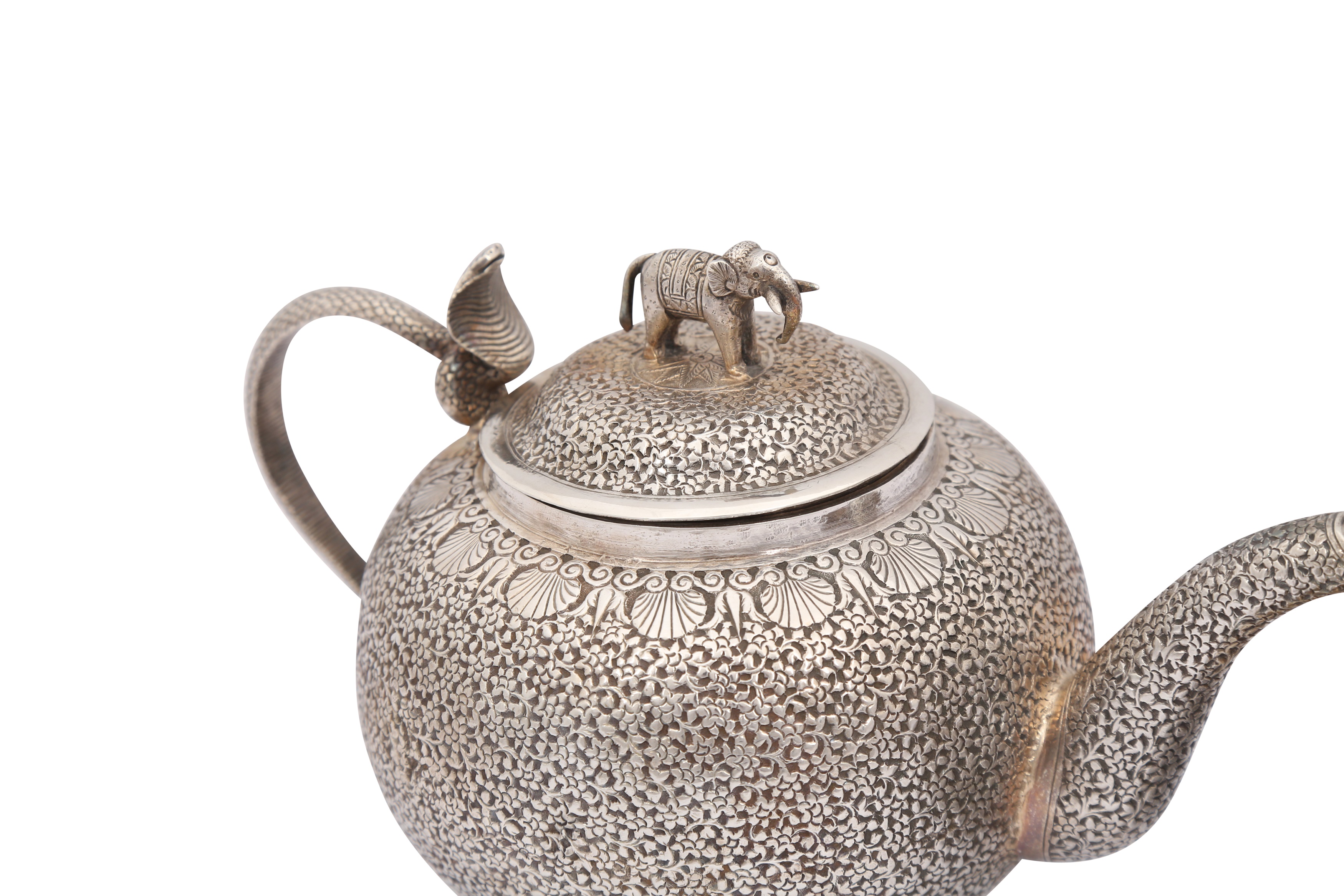 Lot 210 - A THREE-PIECE INDIAN SILVER TEA SET