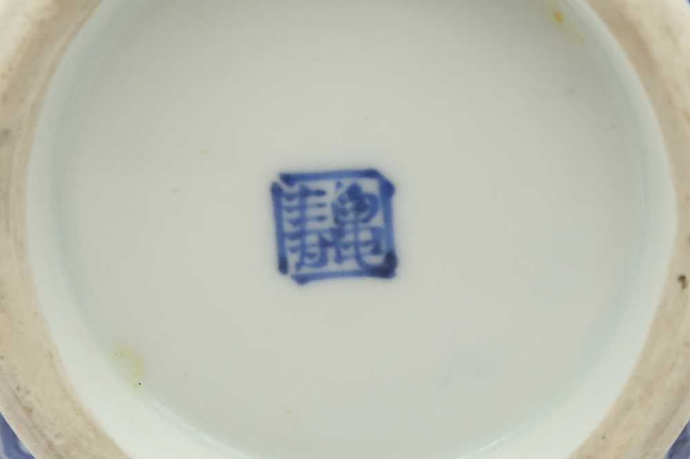 Lot 14 - A CHINESE BLUE AND WHITE LOOP-HANDLED