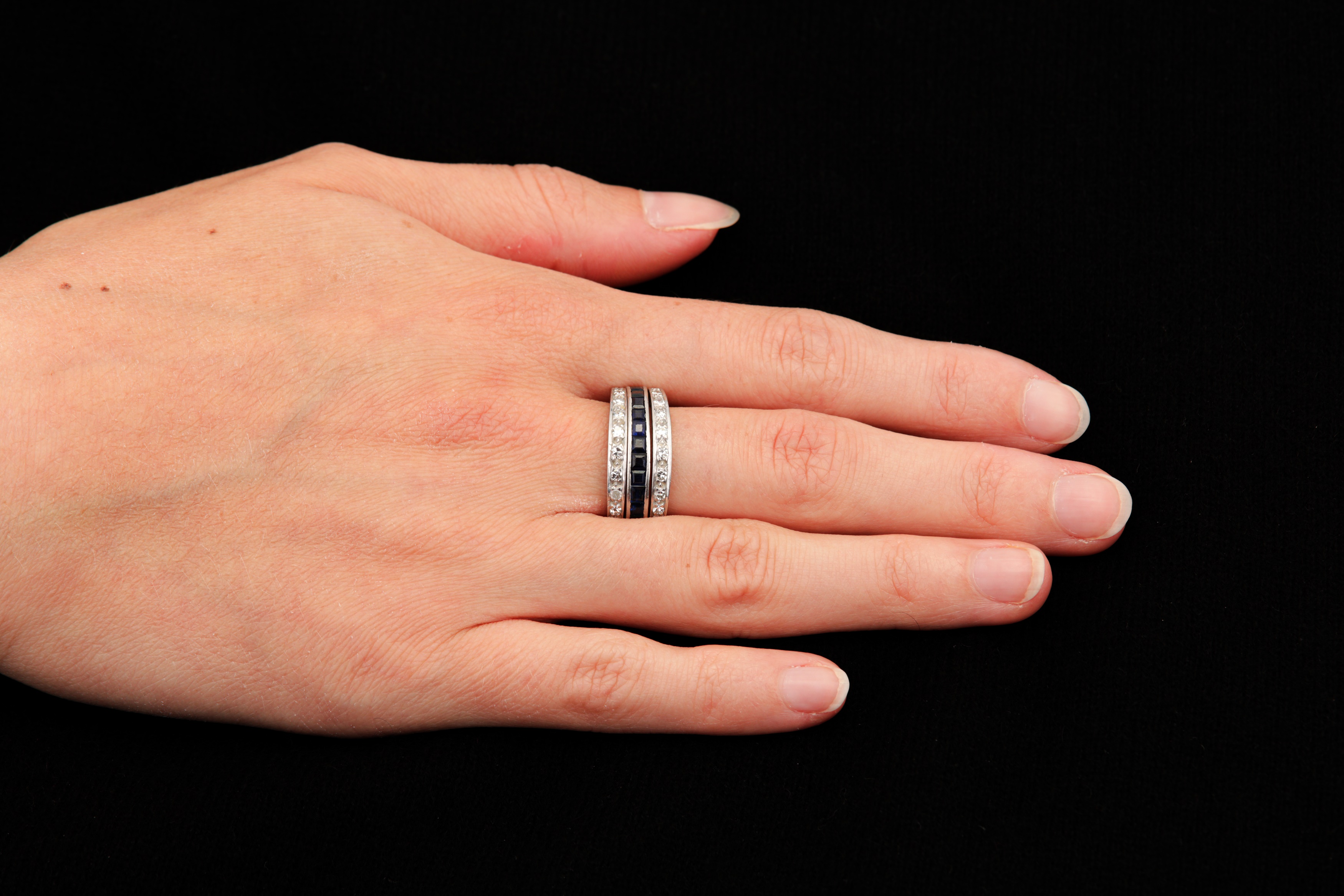 Lot 160 - A ruby, sapphire and diamond swivel ring,