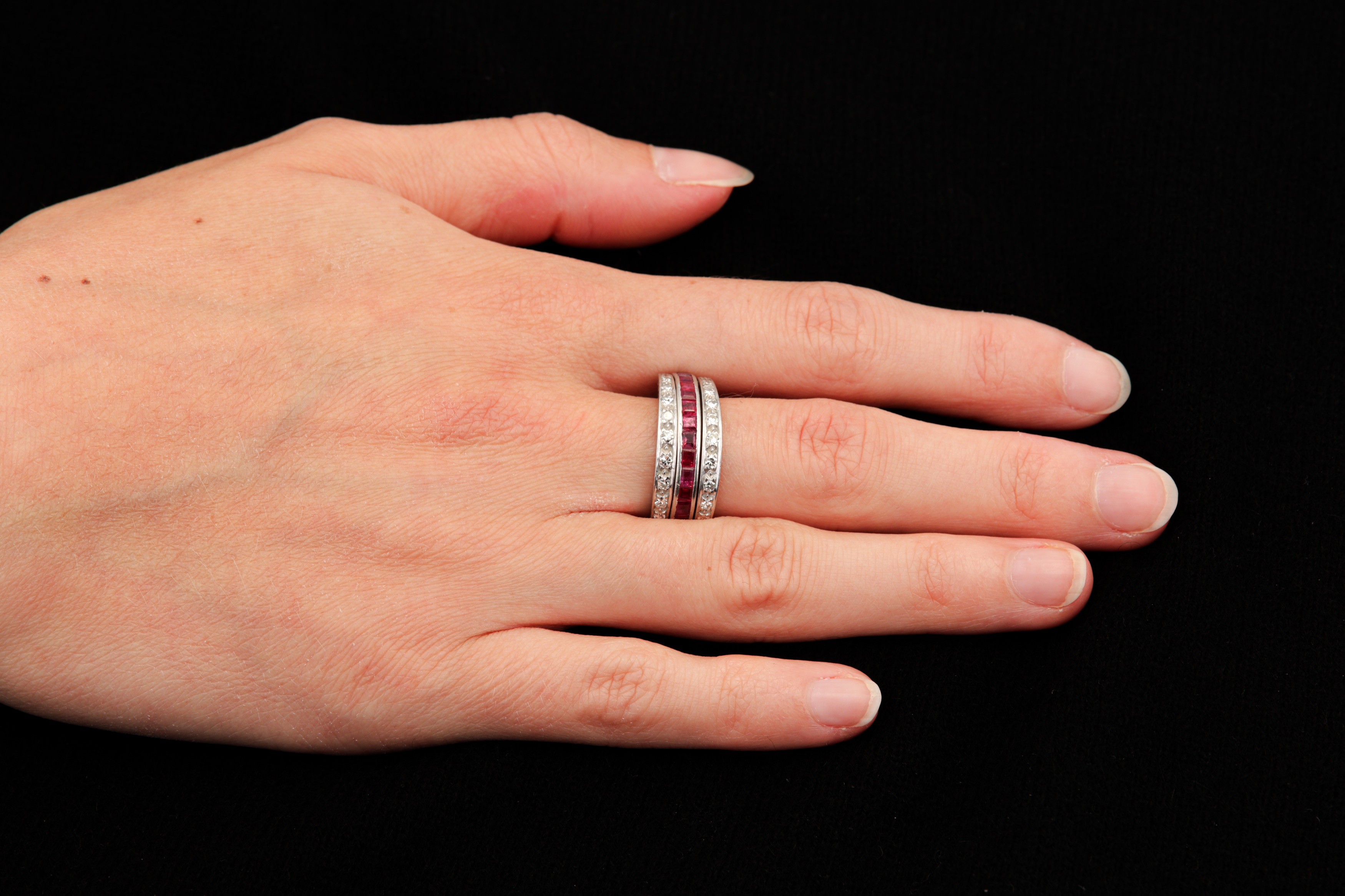 Lot 160 - A ruby, sapphire and diamond swivel ring,