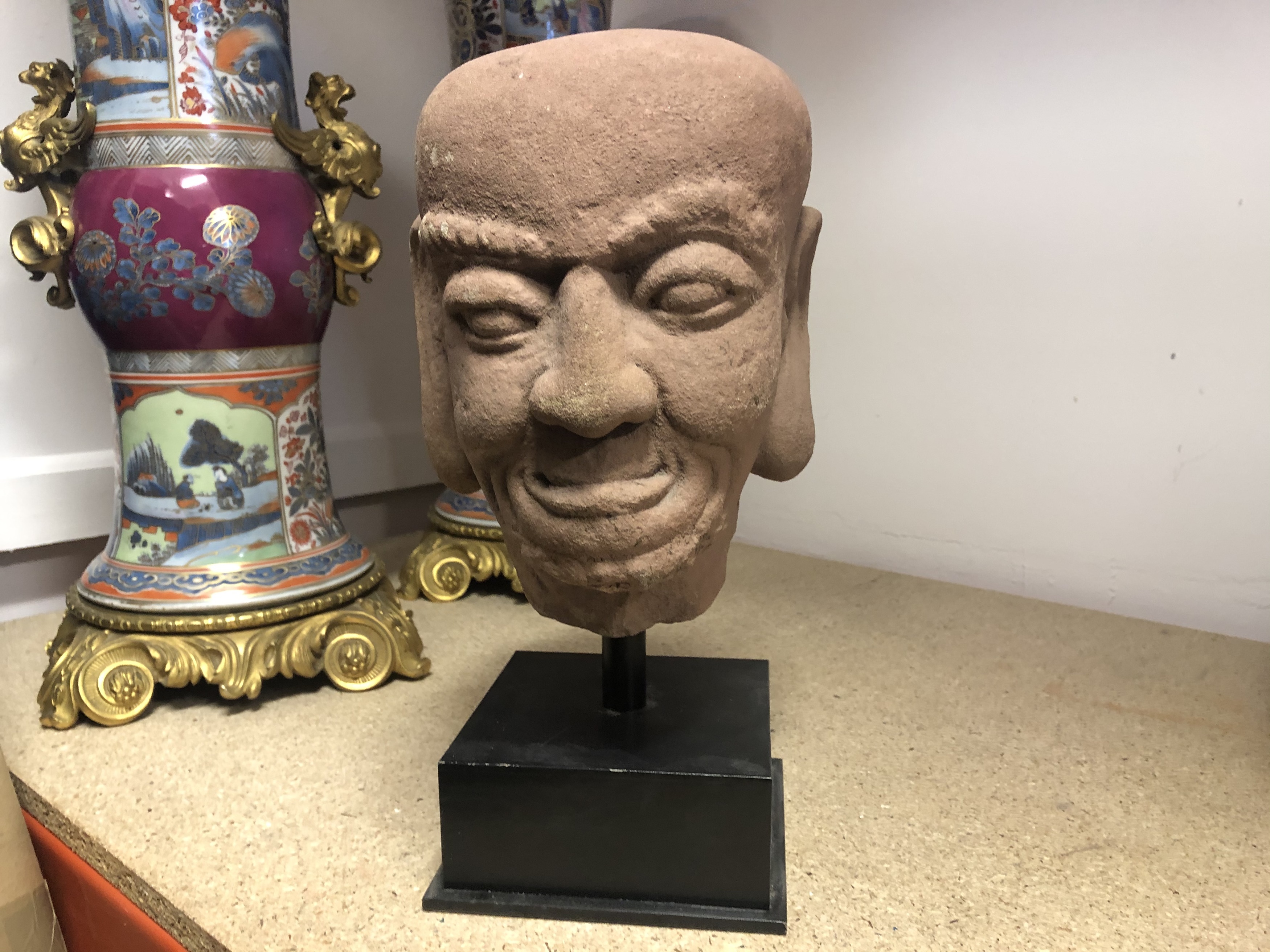 Lot 656 - A CHINESE STONE HEAD OF AN ARHAT.