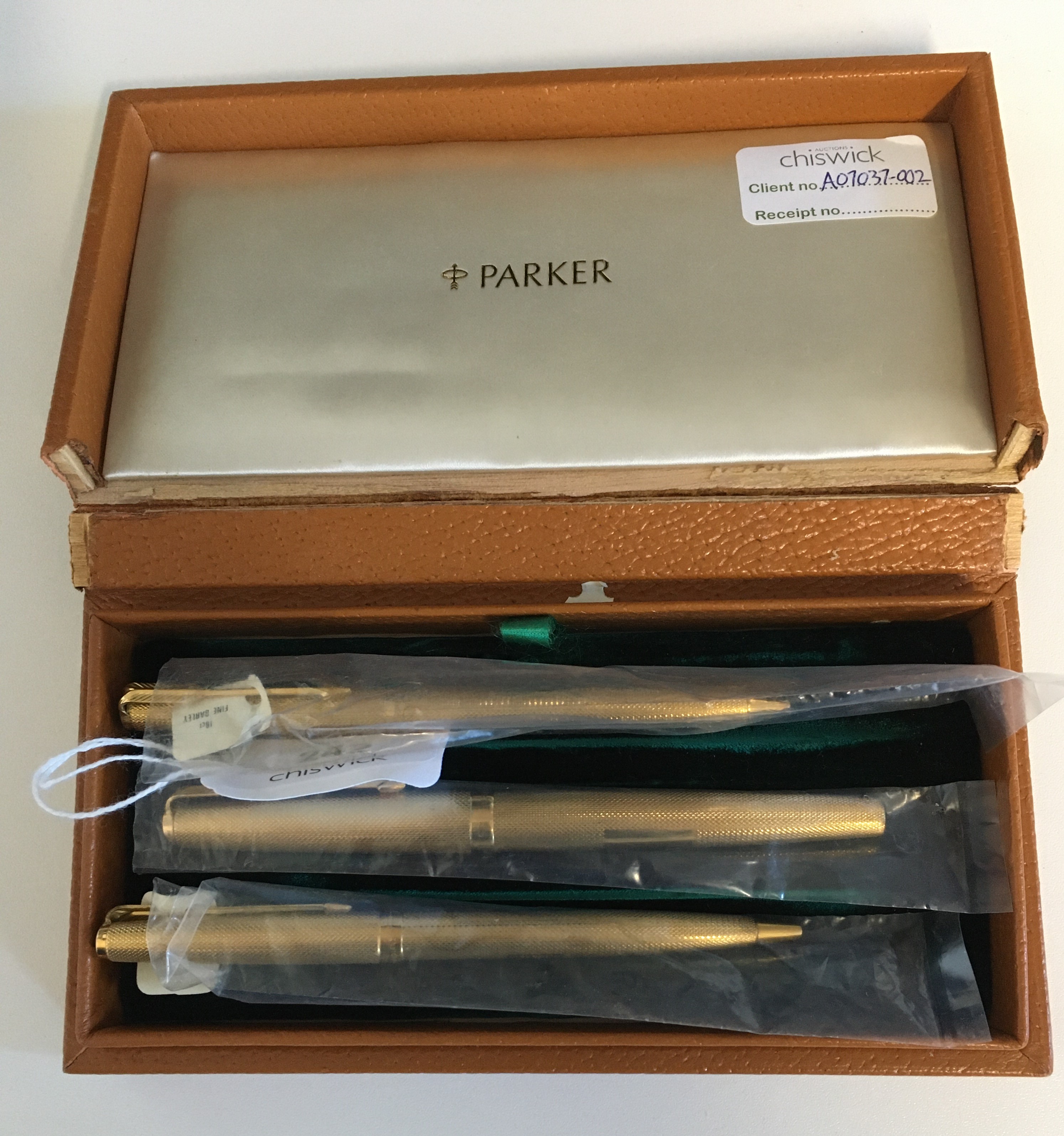 Lot 242 - A set of three 18ct gold Parker pens,