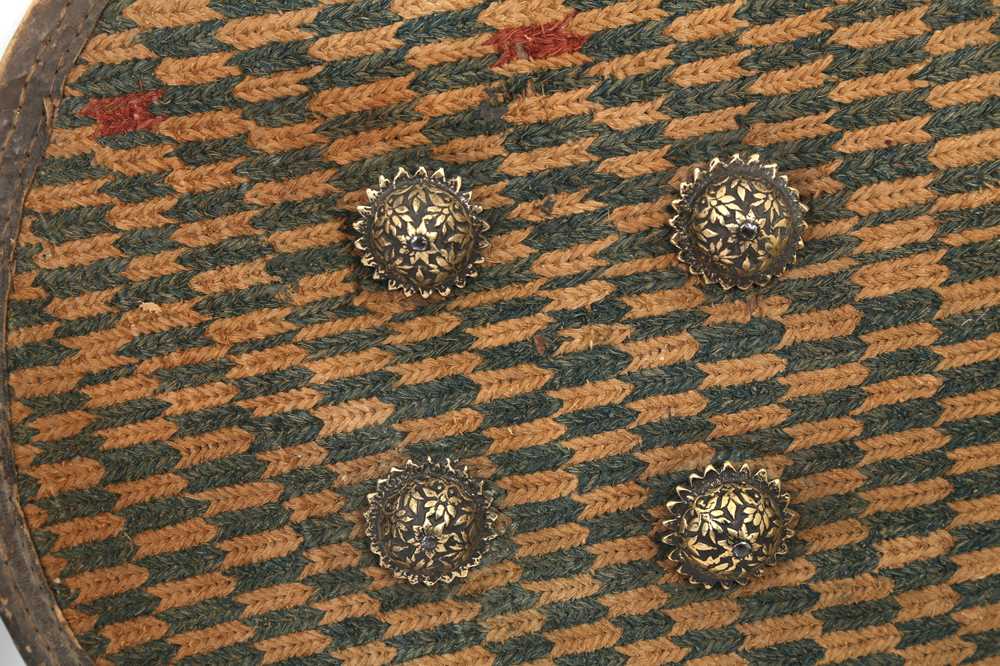 Lot 405 - A BRAIDED STRAW CEREMONIAL SHIELD AND A