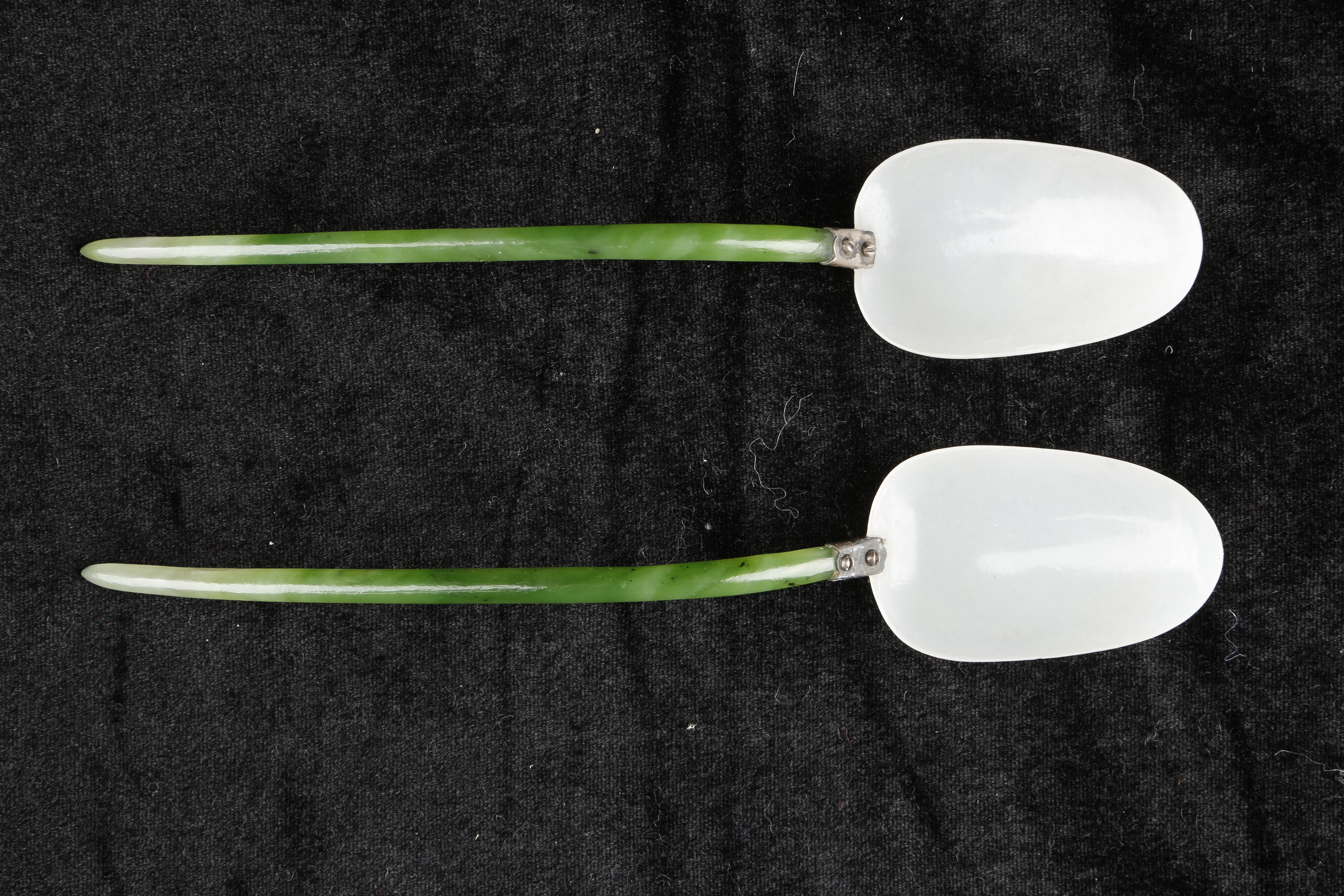 Lot 155 - A PAIR OF TWO COLOUR JADE SPOONS. Qing
