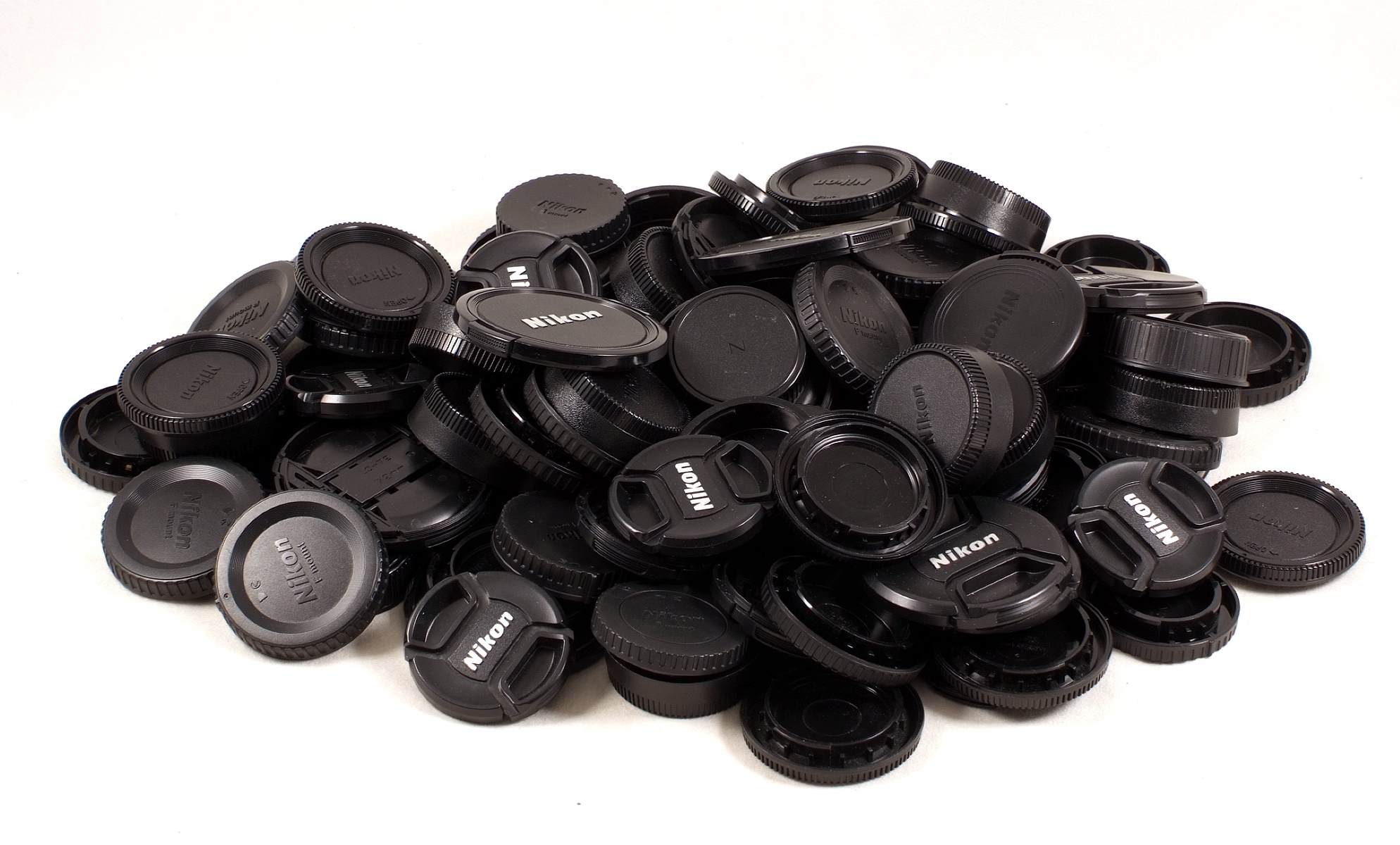 Lot 435 - Around 80 Nikon Camera Body Caps & Lens Caps