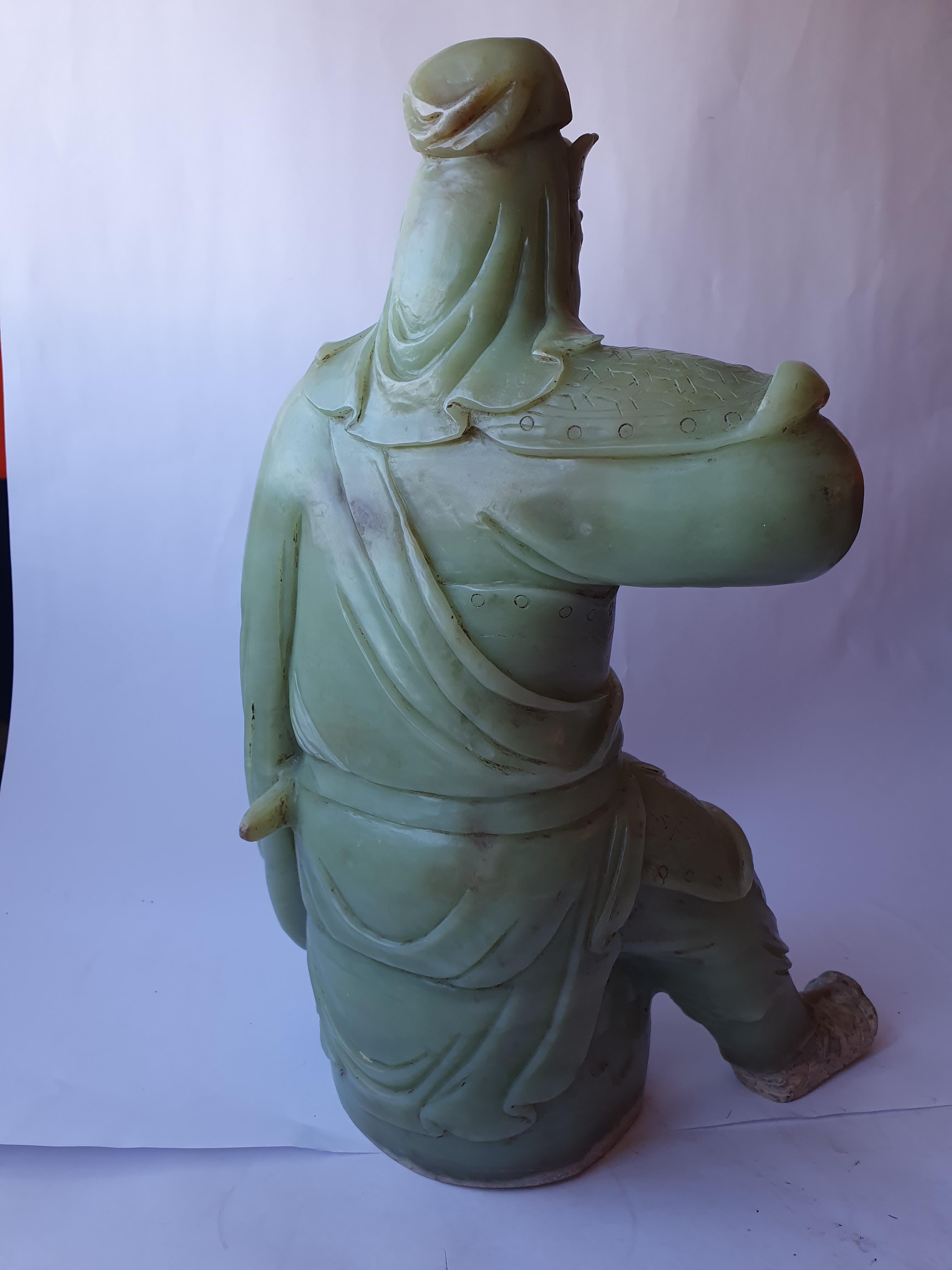 Lot 530 - TWO CHINESE JADE CARVINGS AND A STONE