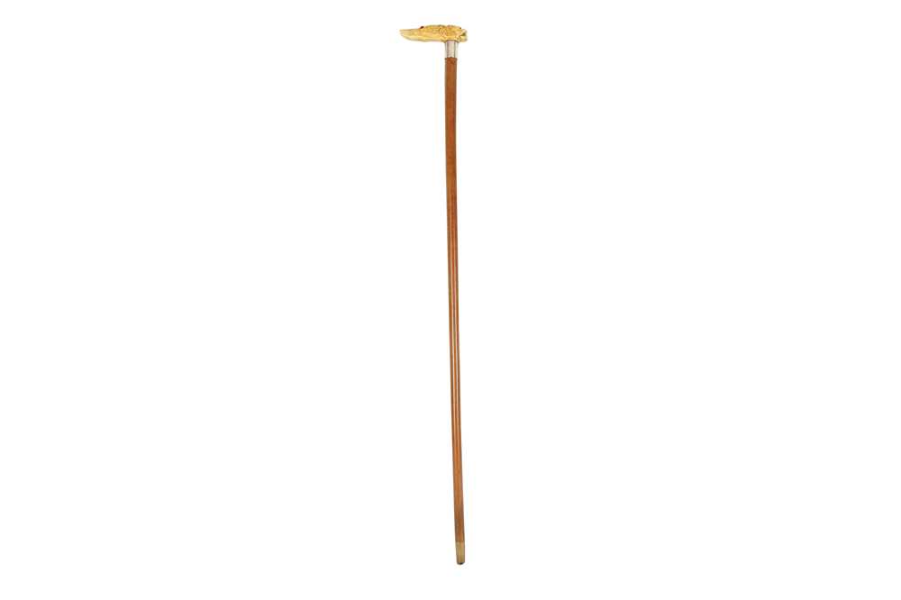 Lot 254 - A CARVED MARINE IVORY HANDLED WALKING CANE,