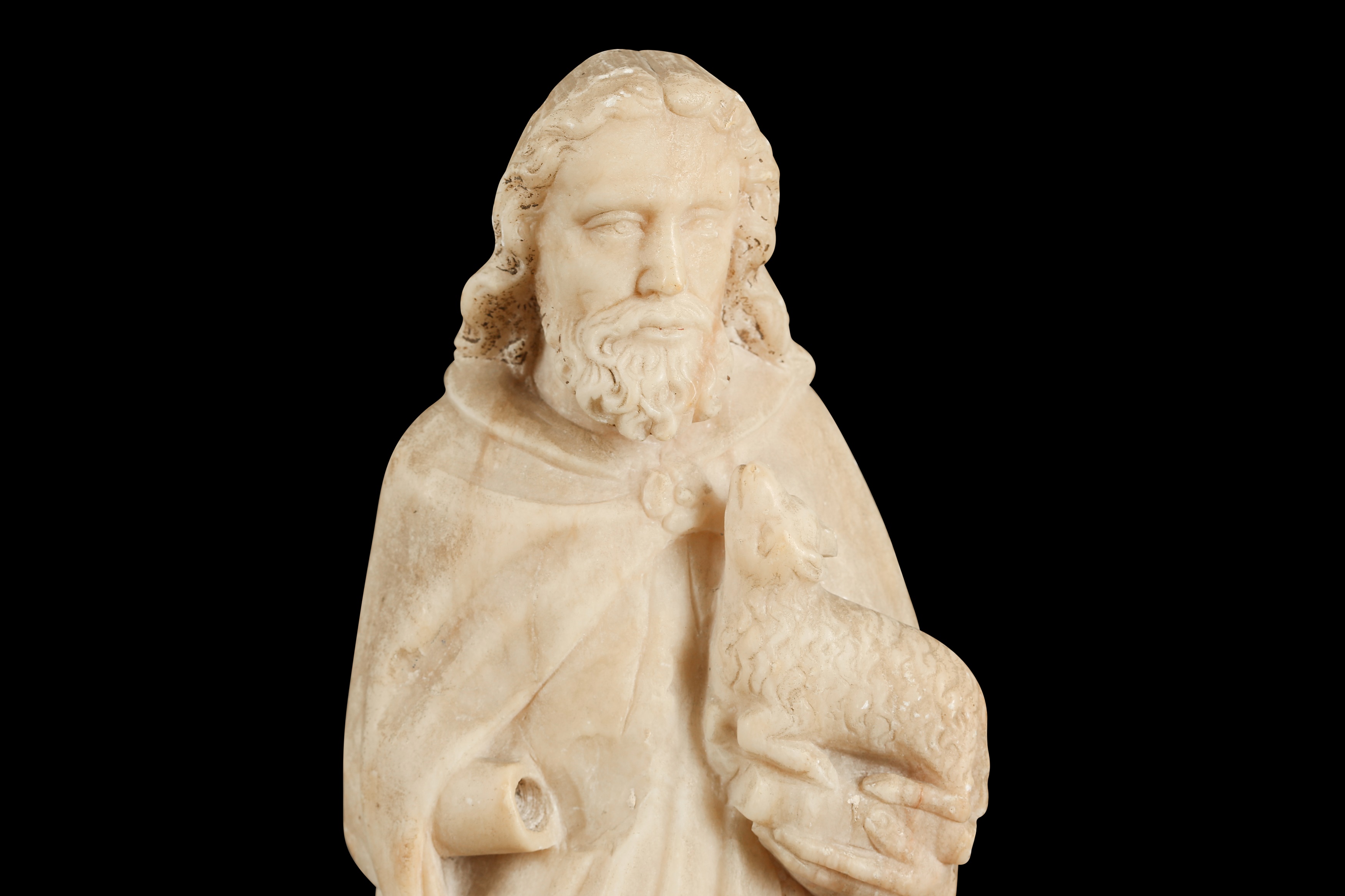 Lot 118 - AN ALABASTER FIGURE OF ST JOHN THE BAPTIST,