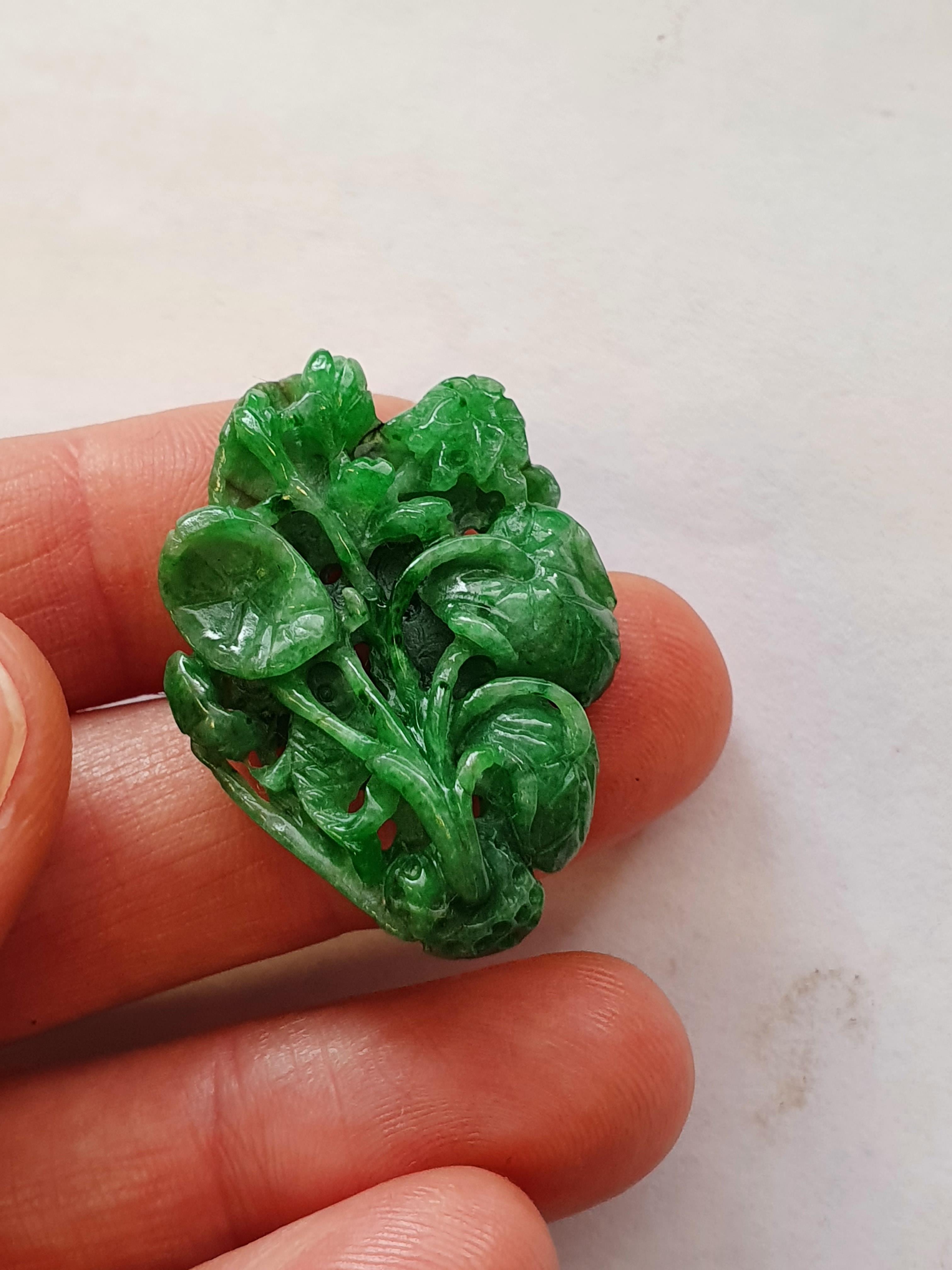 Lot 58 - TWO CHINESE JADEITE PENDANTS.