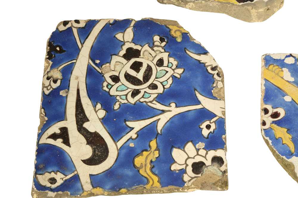 Lot 507 - FIVE FRAGMENTARY SAFAVID CUERDA SECA POTTERY