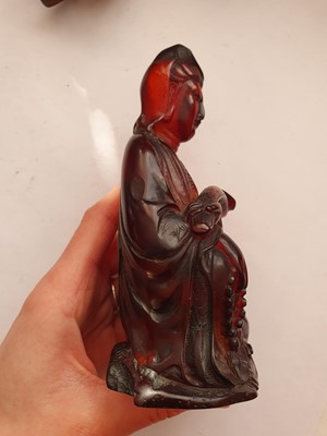 Lot 607 - A CHINESE RECOMPOSITED AMBER FIGURE OF