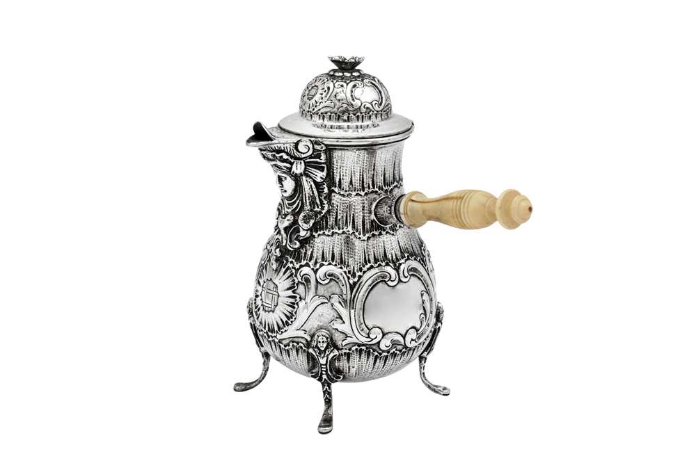 Lot 439 - A late 19th century German silver coffee pot,