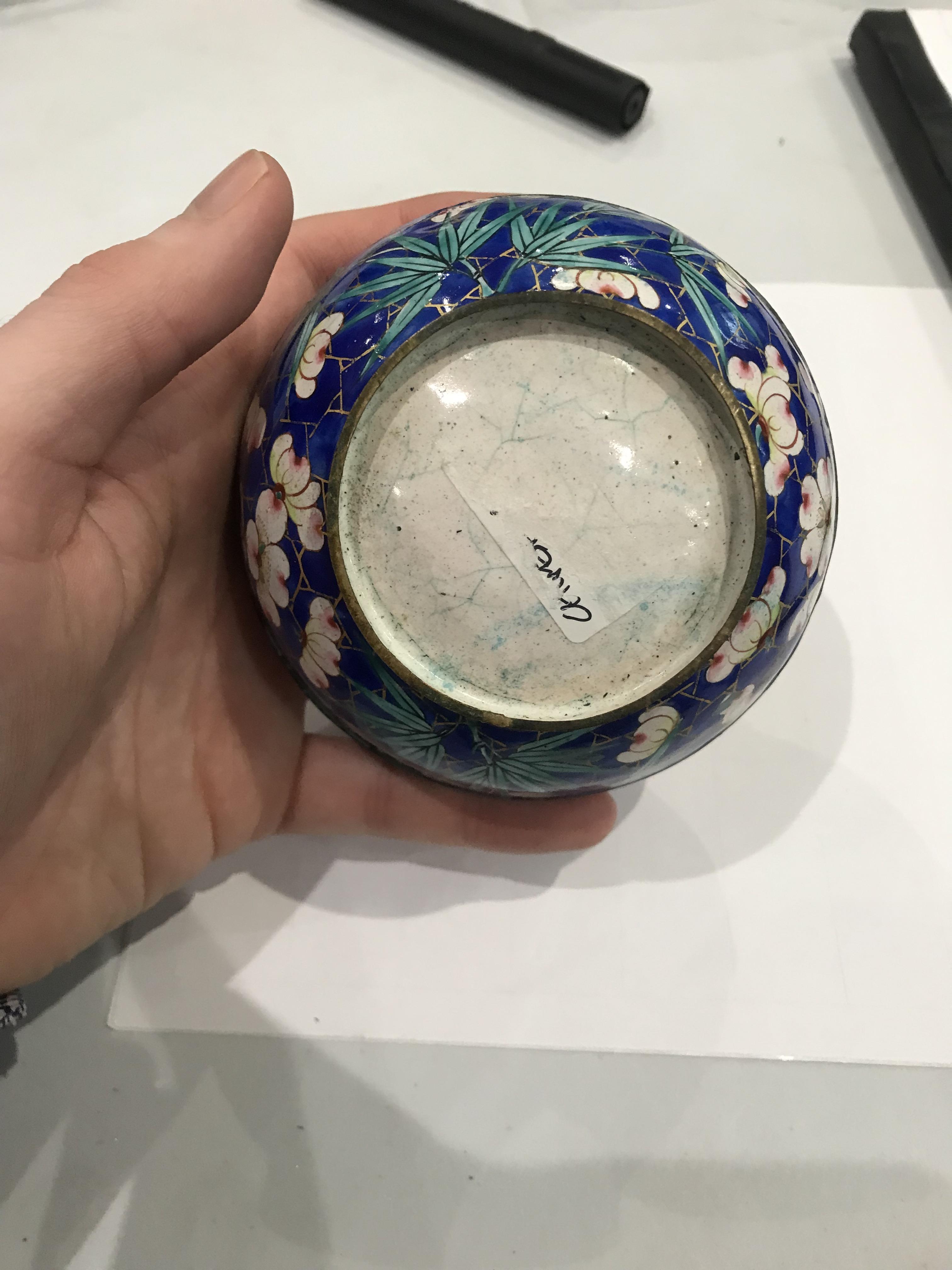 Lot 714 - A CHINESE BLUE-GROUND CANTON ENAMEL 'PRUNUS