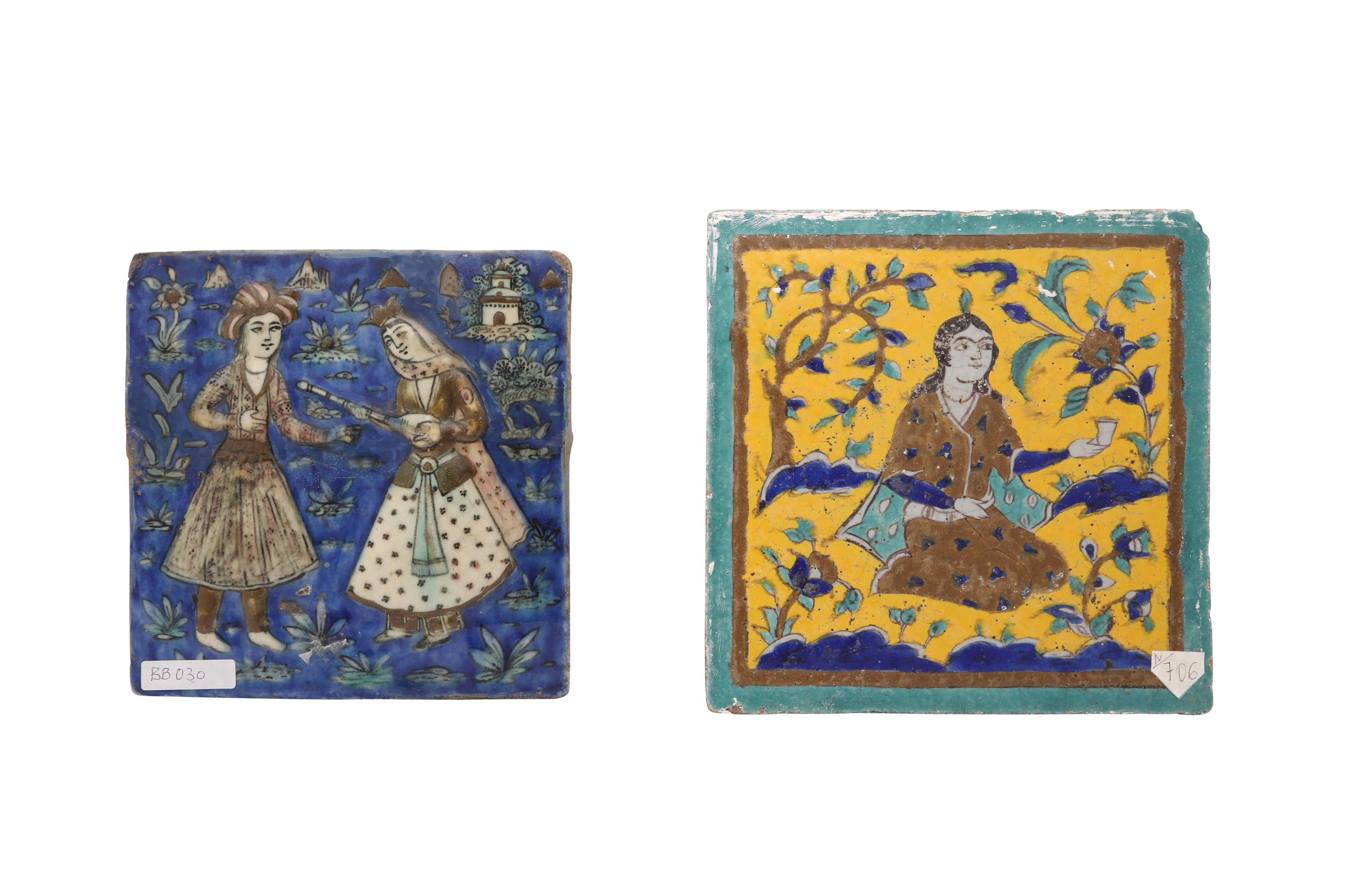 Lot 45 - TWO QAJAR FIGURAL POTTERY TILES