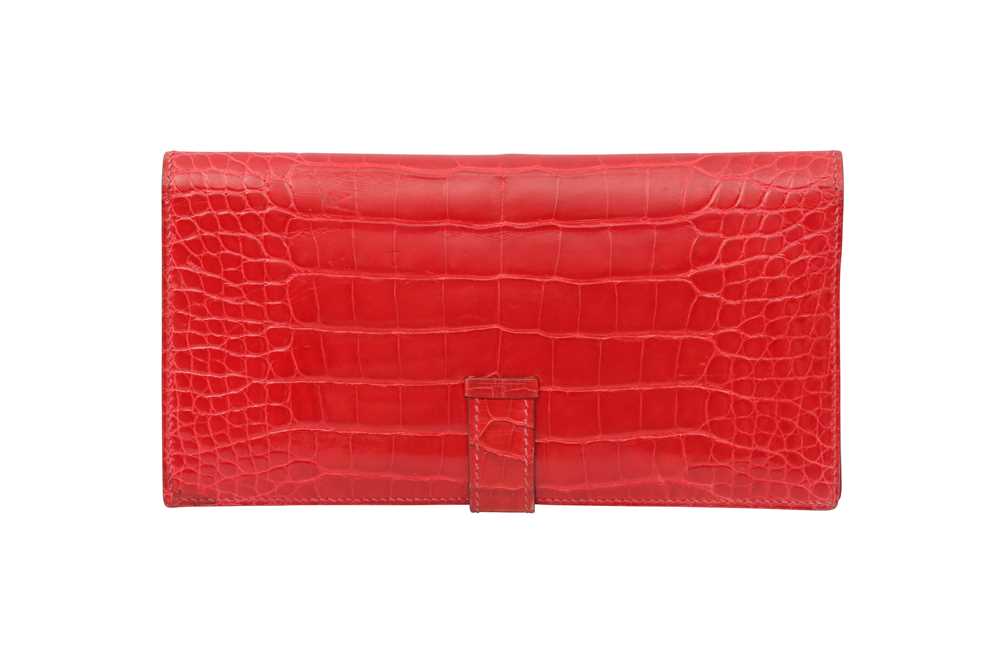 Lot 15 - λ Hermes Red Shiny Crocodile Bearn Wallet