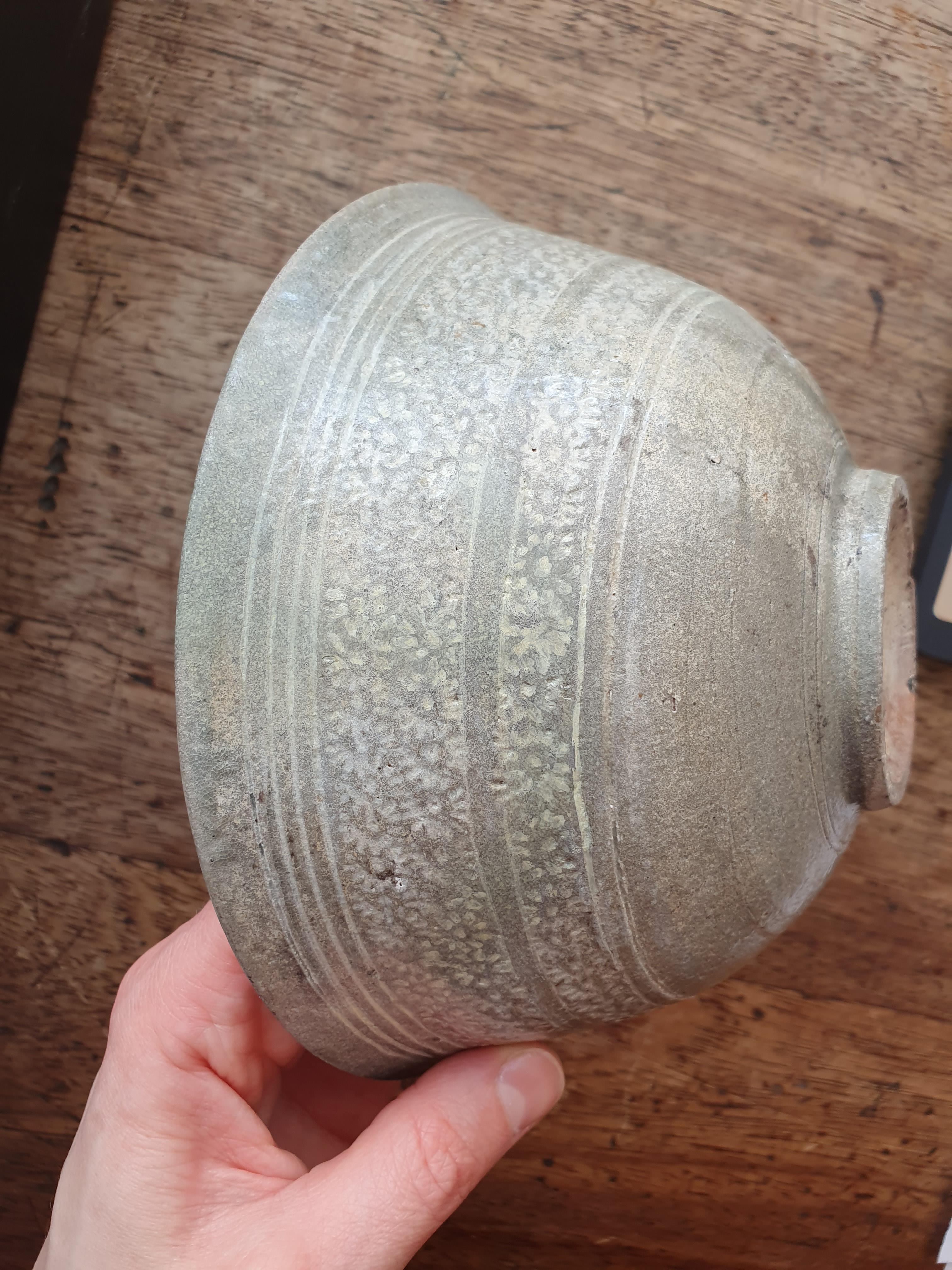 Lot 412 - A KOREAN SANGGAM SLIP-DECORATED CELADON BOWL.