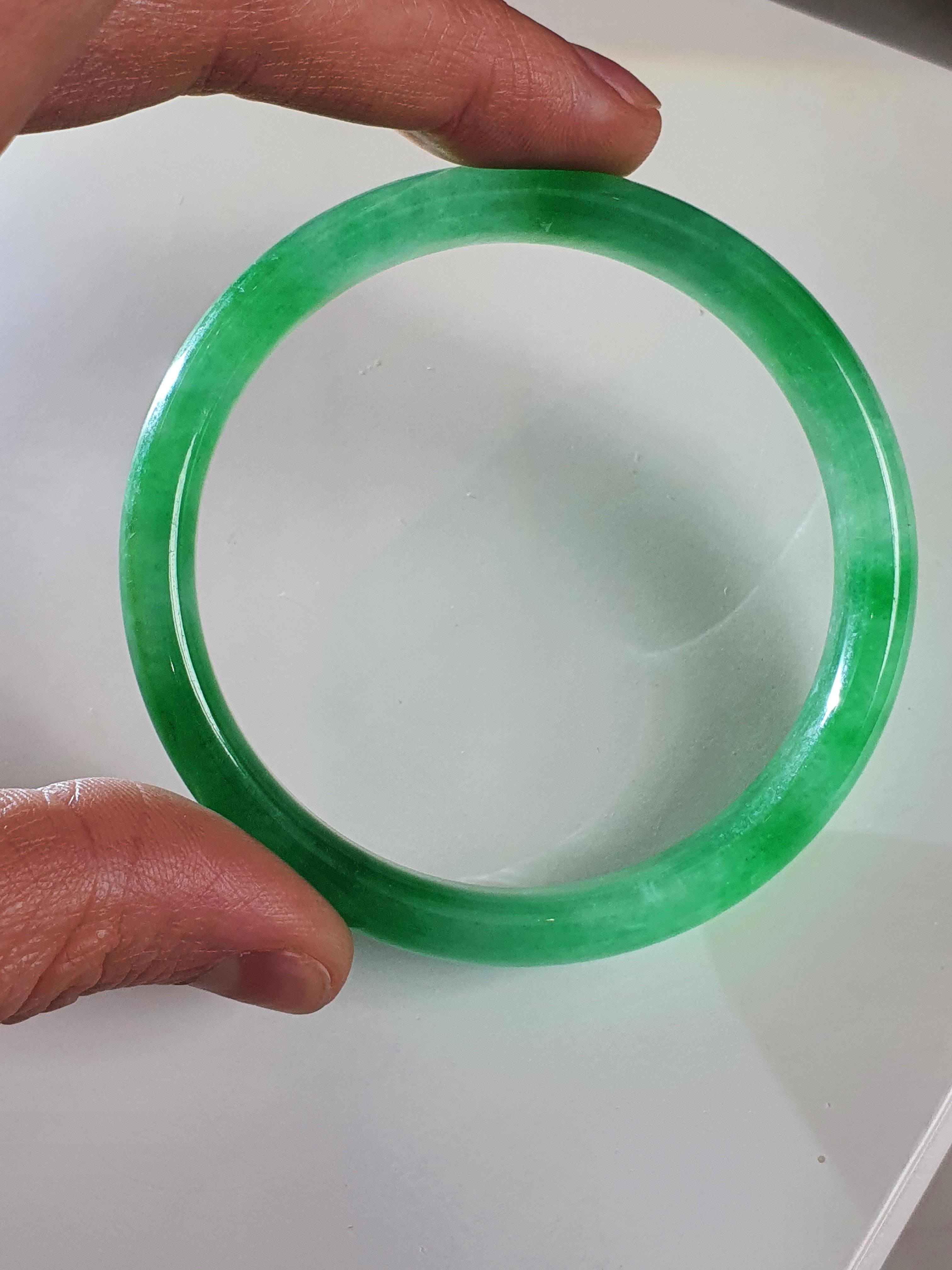 Lot 194 - TWO CHINESE JADEITE BANGLES.