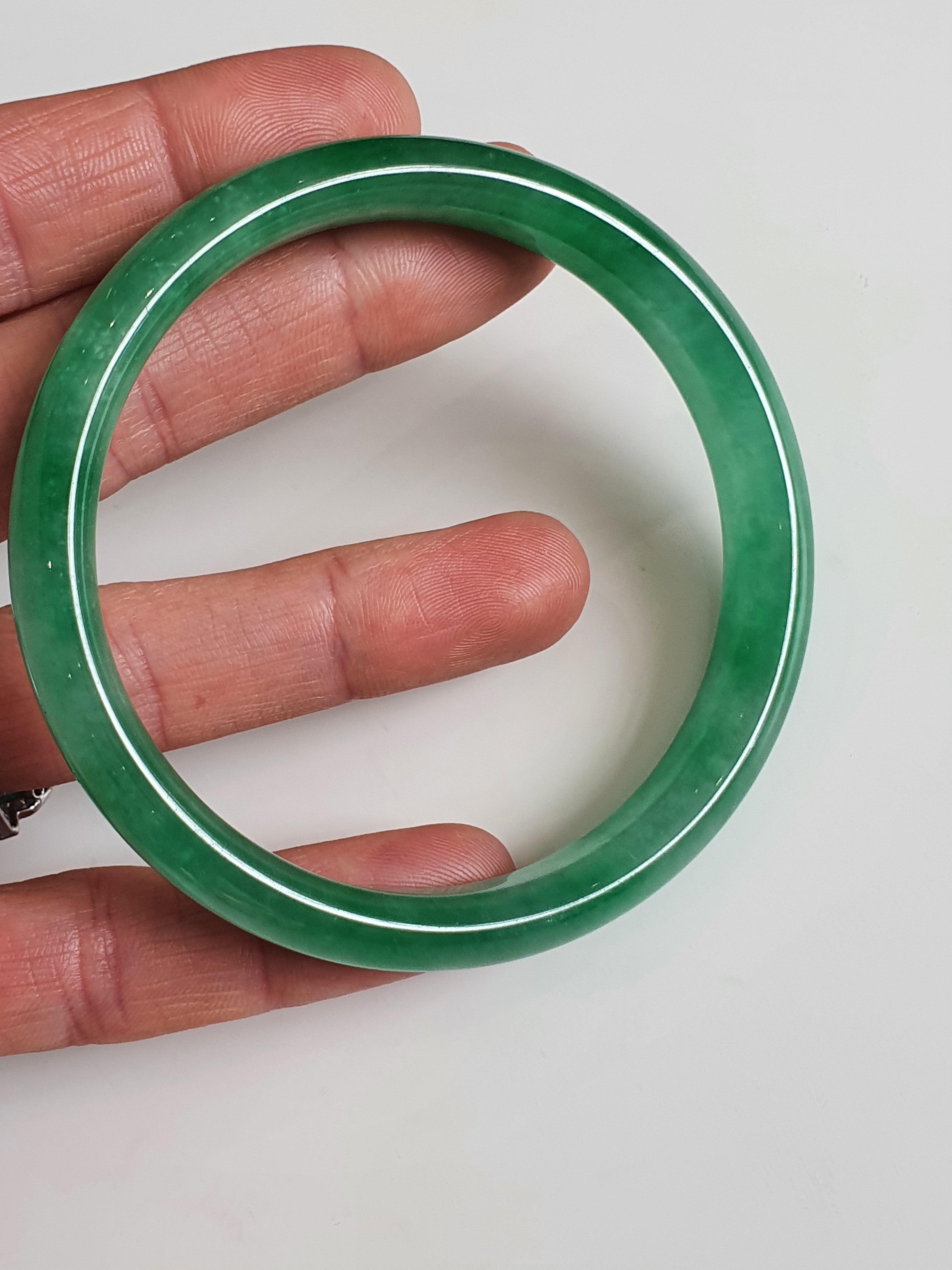 Lot 194 - TWO CHINESE JADEITE BANGLES.