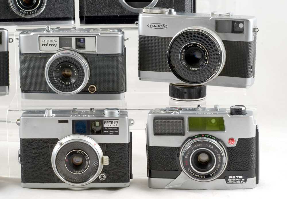 Lot 520 - A Good Group of 8 Half Frame Cameras.