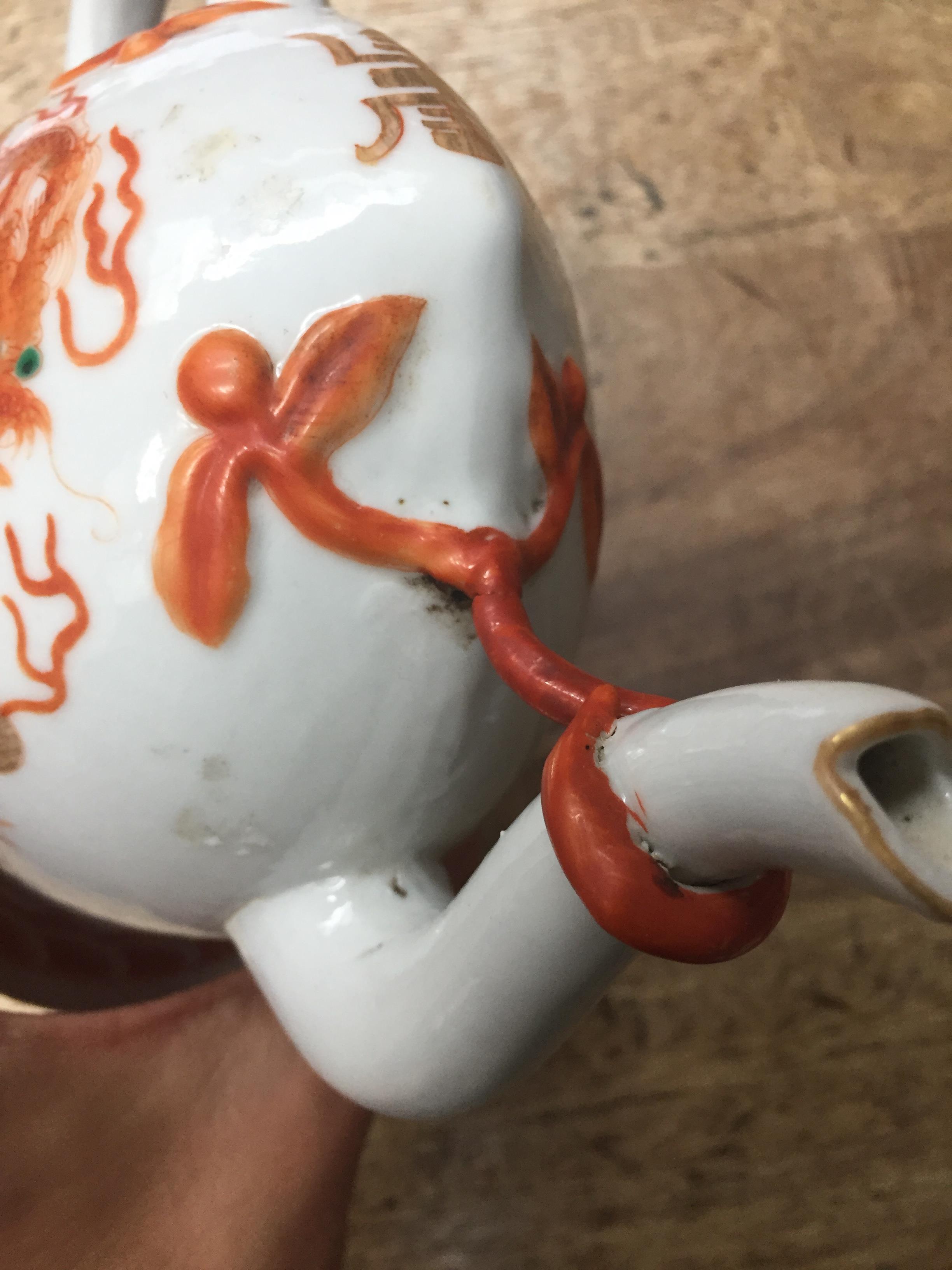 Lot 368 - A CHINESE IRON-RED 'DRAGON' CADOGAN TEAPOT.