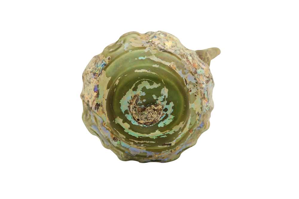 Lot 547 - A MOULD-BLOWN LIGHT GREEN GLASS JUG WITH