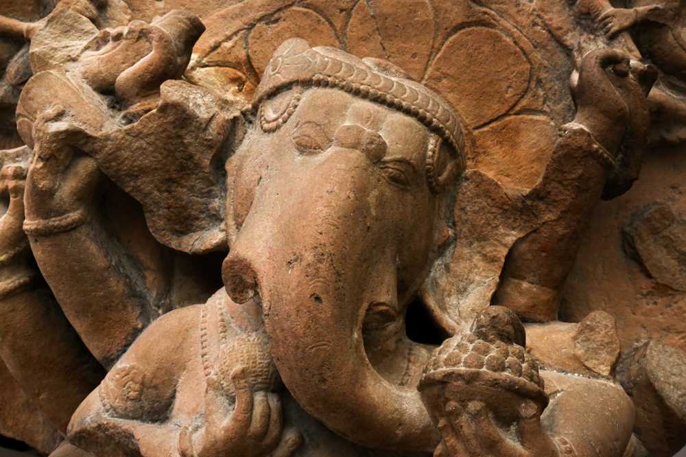 Lot 250 - A MEDIEVAL INDIAN BUFF SANDSTONE SCULPTURE