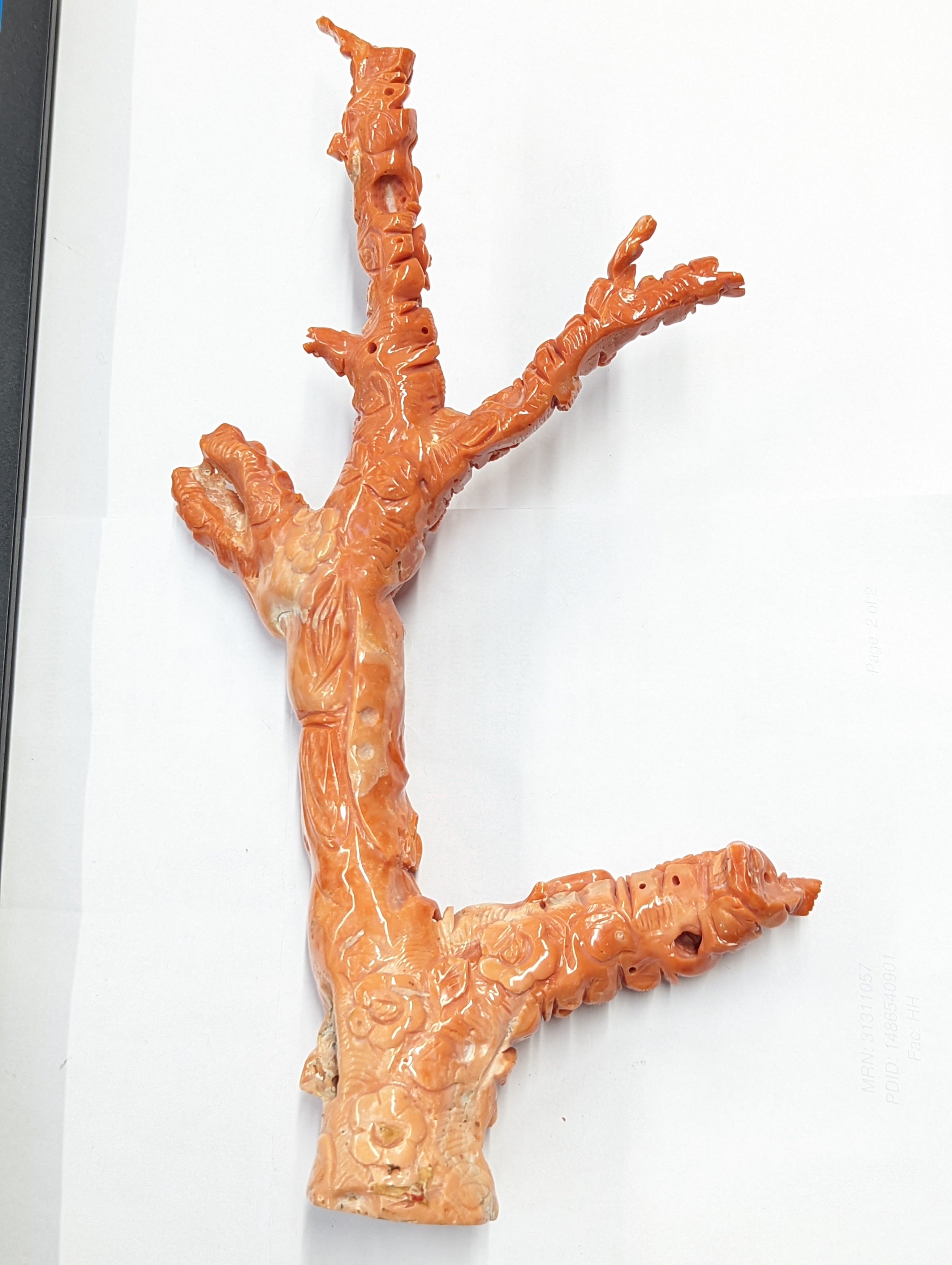 Lot 325 - λ A CHINESE CORAL CARVING OF AN IMMORTAL
