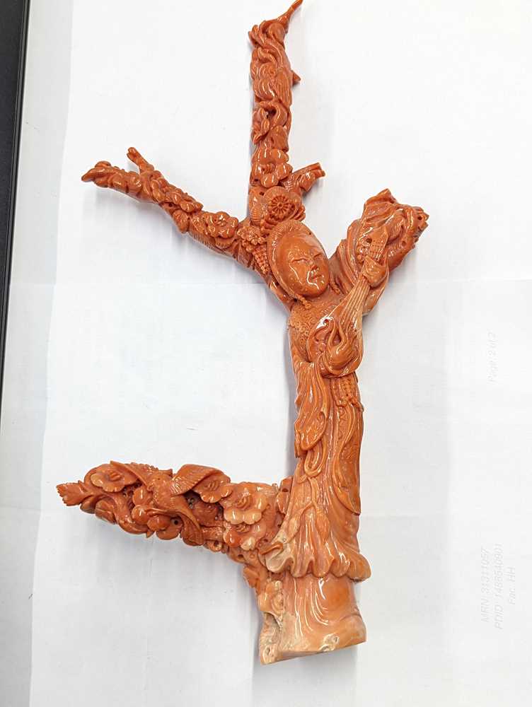 Lot 325 - λ A CHINESE CORAL CARVING OF AN IMMORTAL