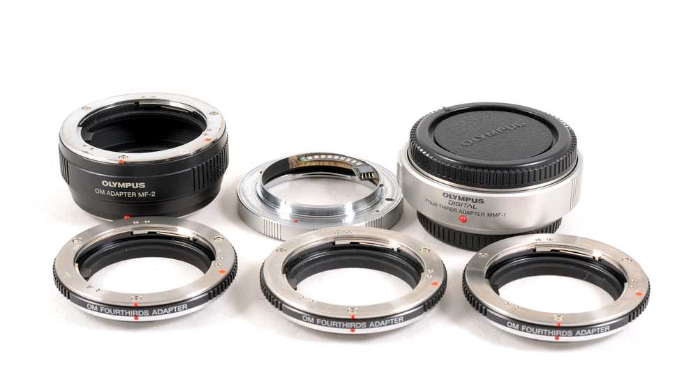 Lot 5 - A Selection of Adapters for using OM Lenses on