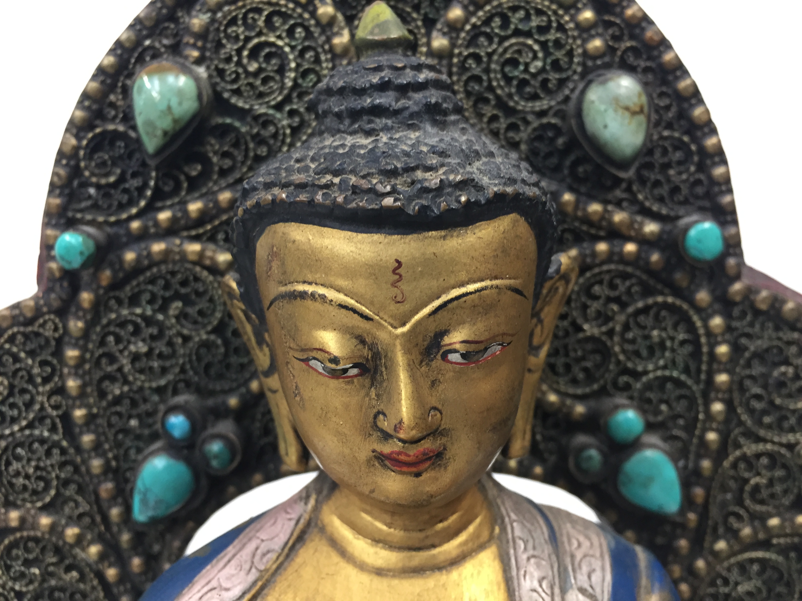 Lot 59 - A NEPALESE PAINTED BRONZE FIGURE OF BUDDHA