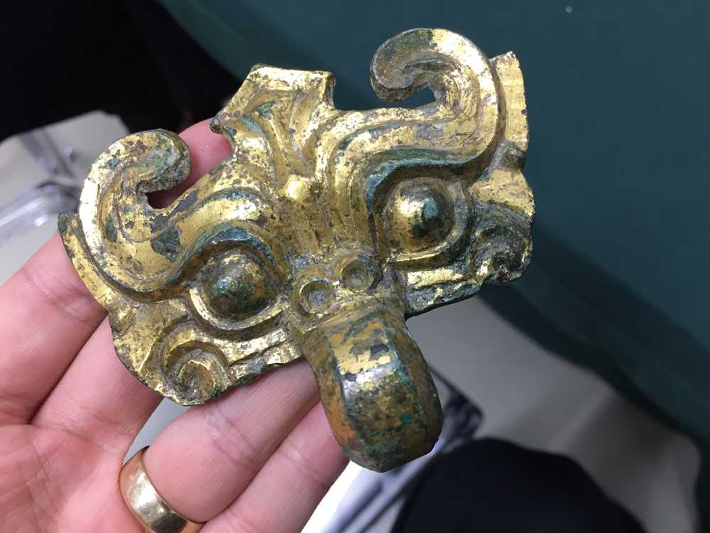 Lot 515 - A CHINESE GILT-BRONZE 'TAOTIE MASK' FIXTURE